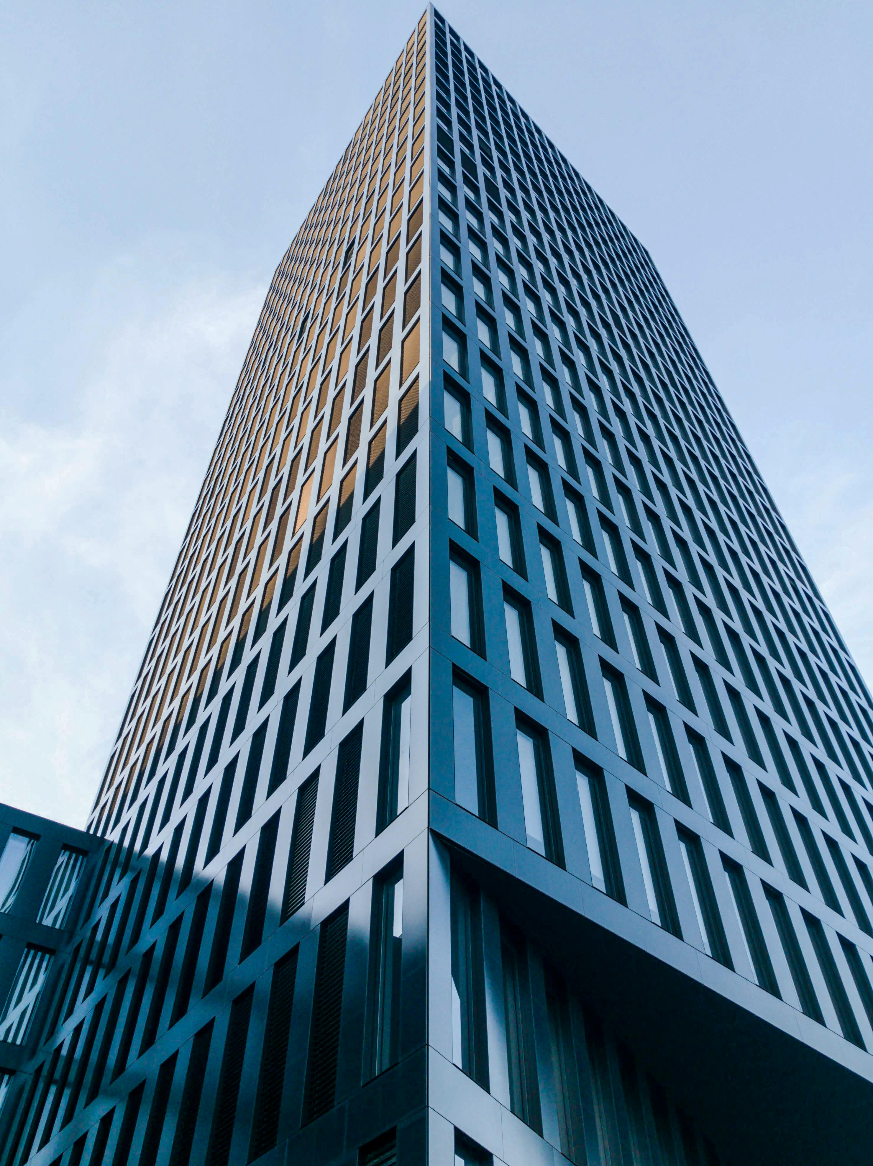 Woman Standing Next to Building · Free Stock Photo