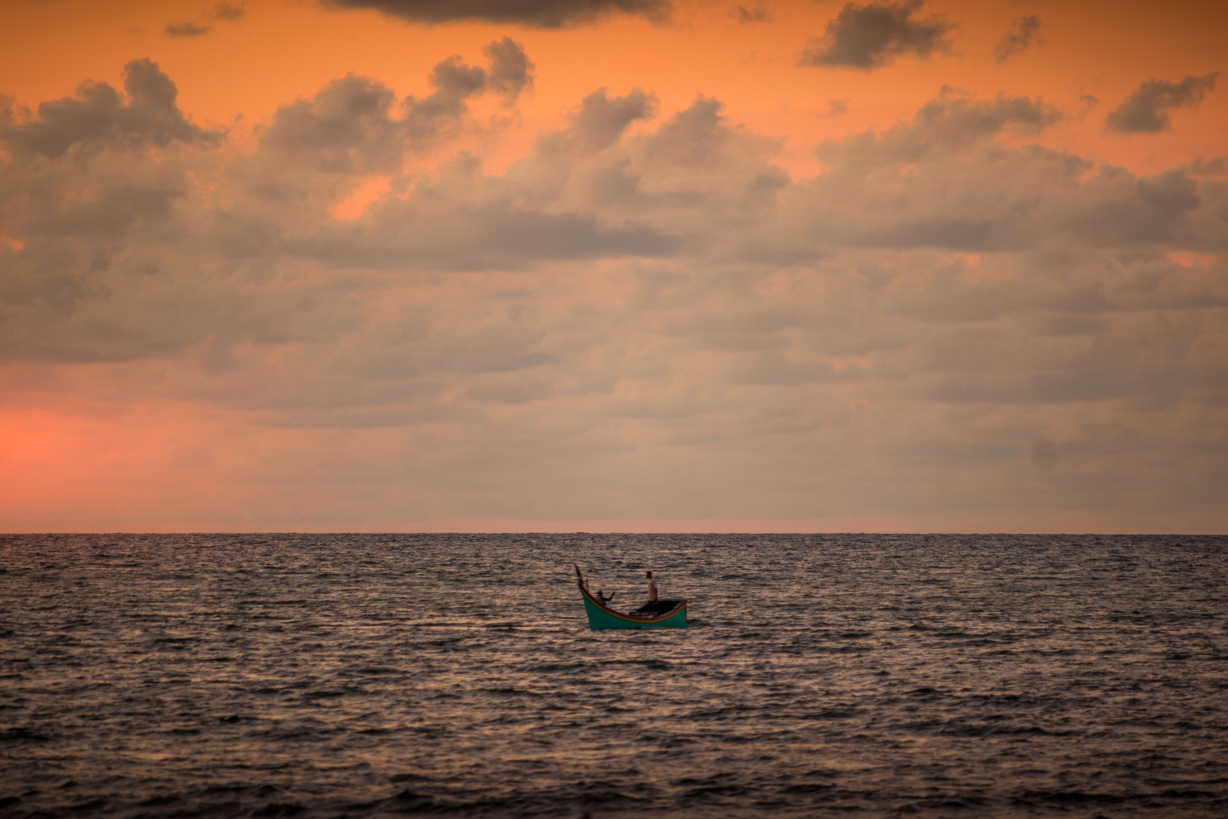 A Person on a Boat during Sunset · Free Stock Photo