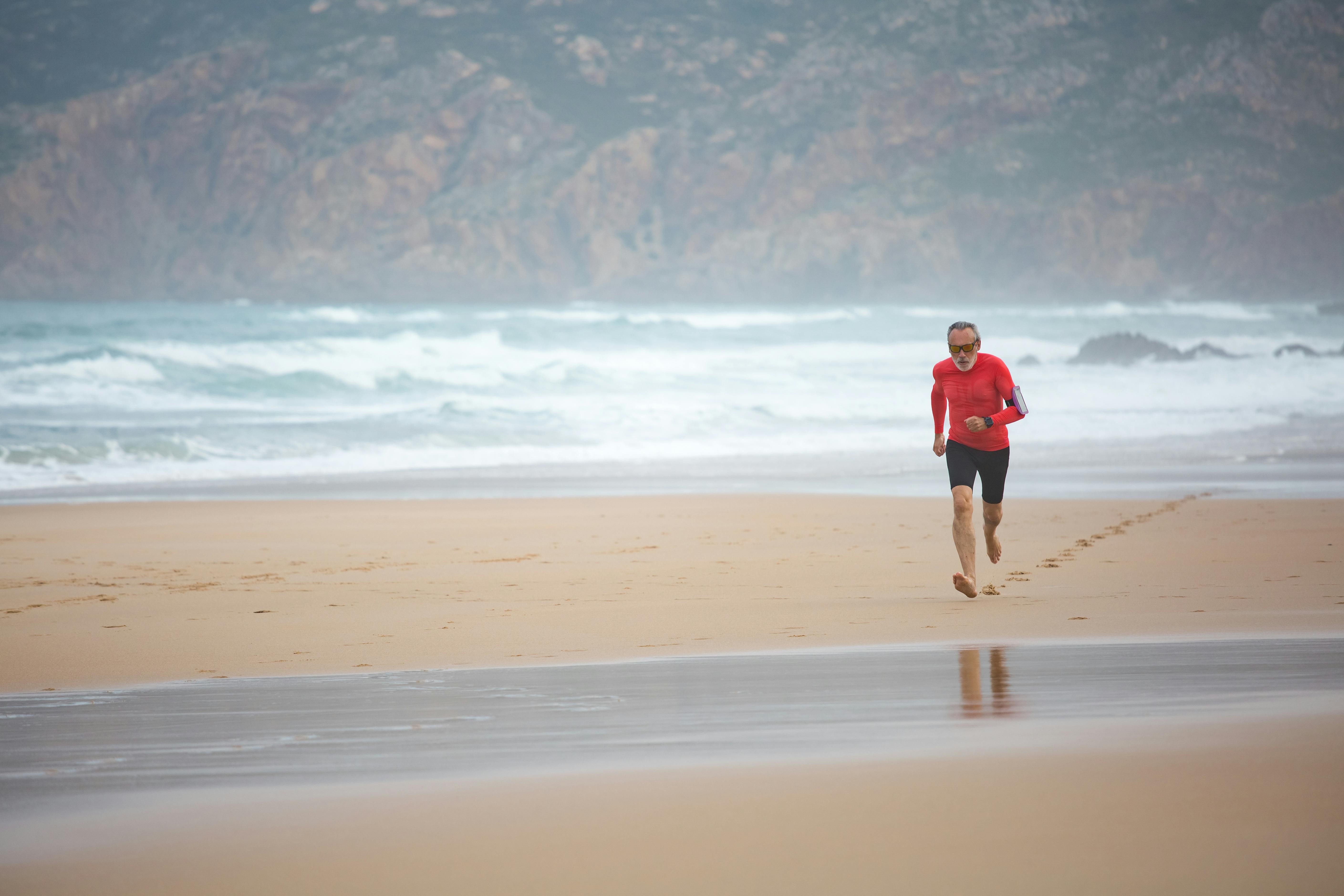 Man Running on Beach Shore · Free Stock Photo