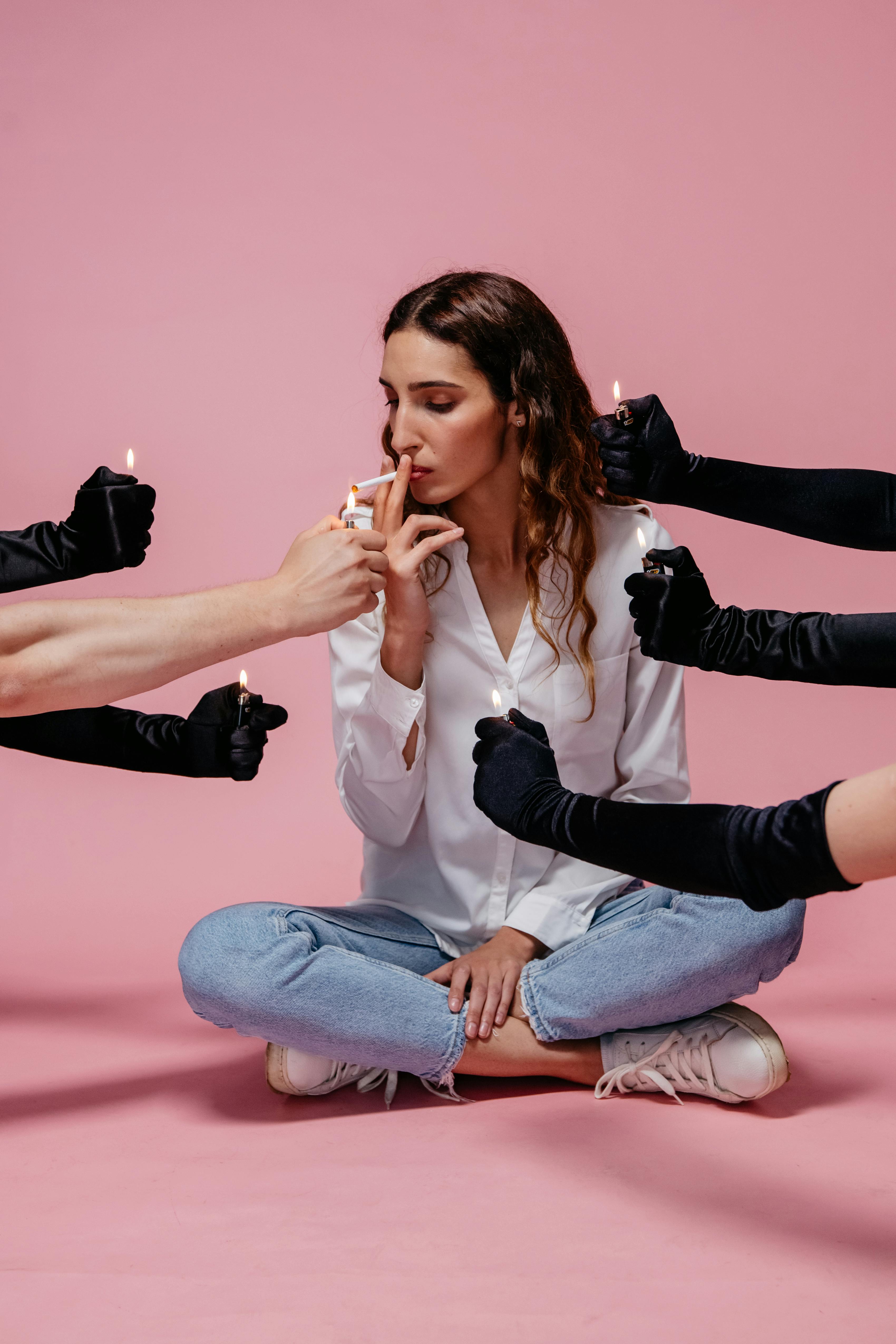 Woman in White Long Sleeves Holding a Cigar · Free Stock Photo