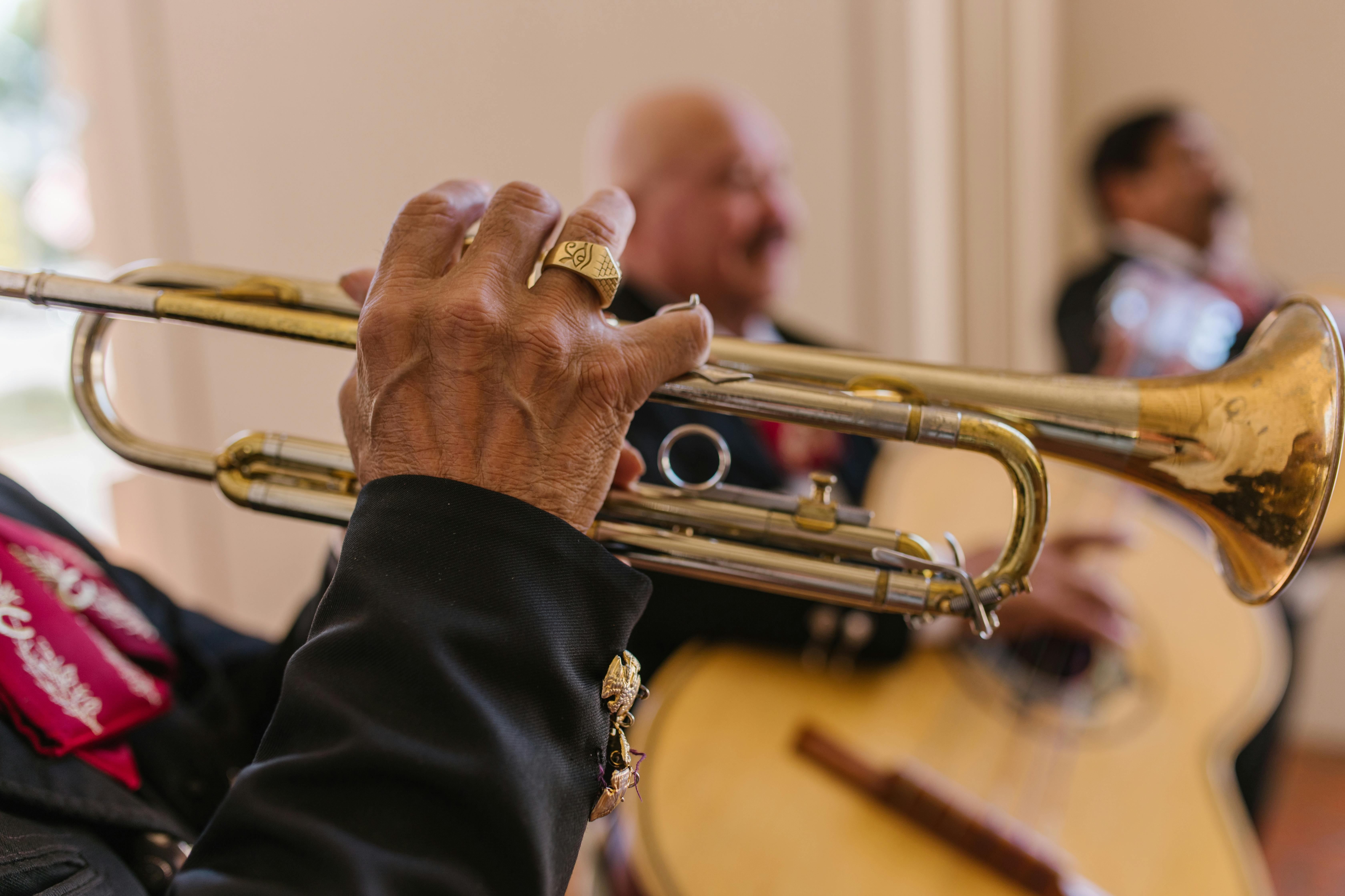 Man Hand Holding Trumpet · Free Stock Photo