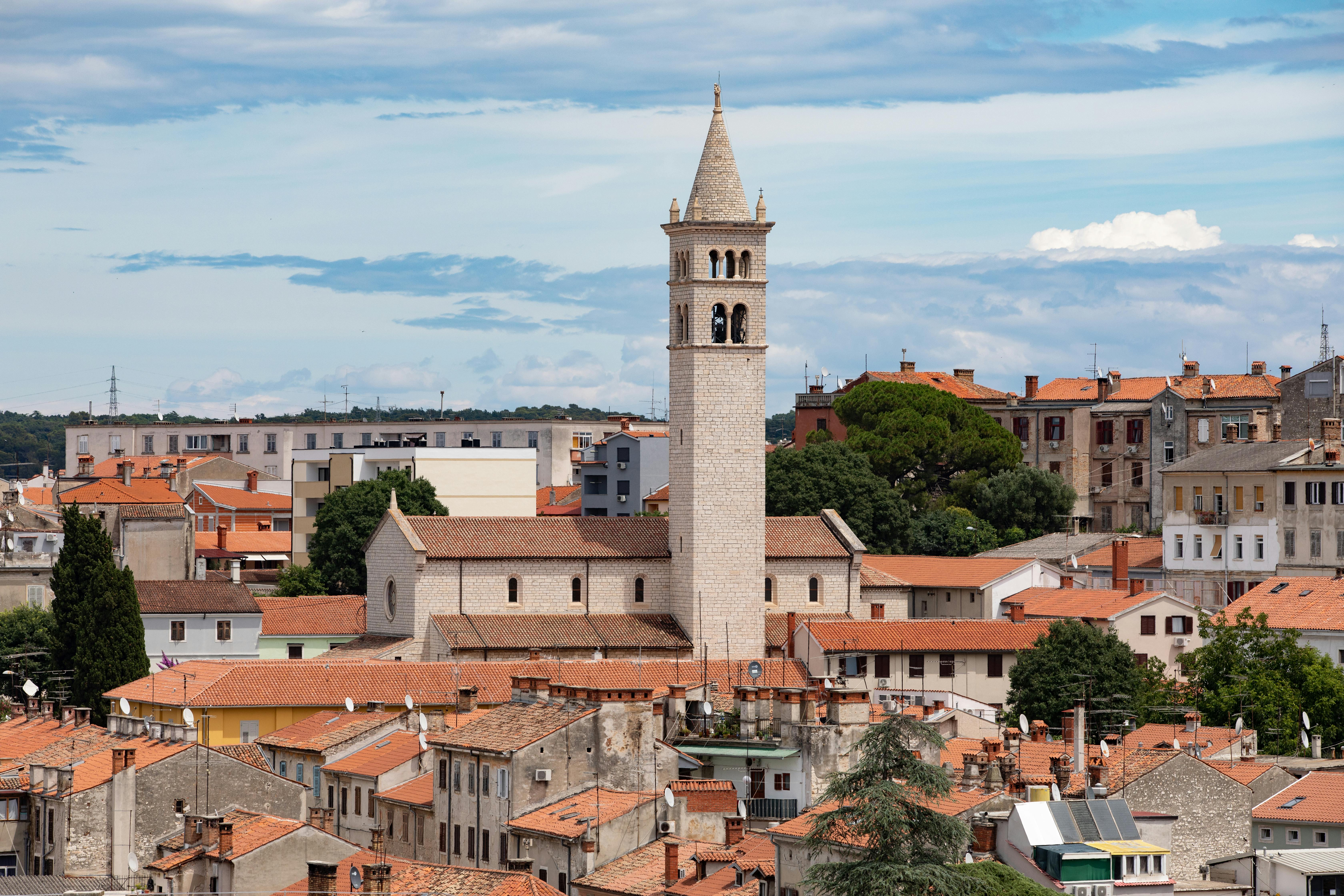 Old Town Rooftops against Blue Sky · Free Stock Photo