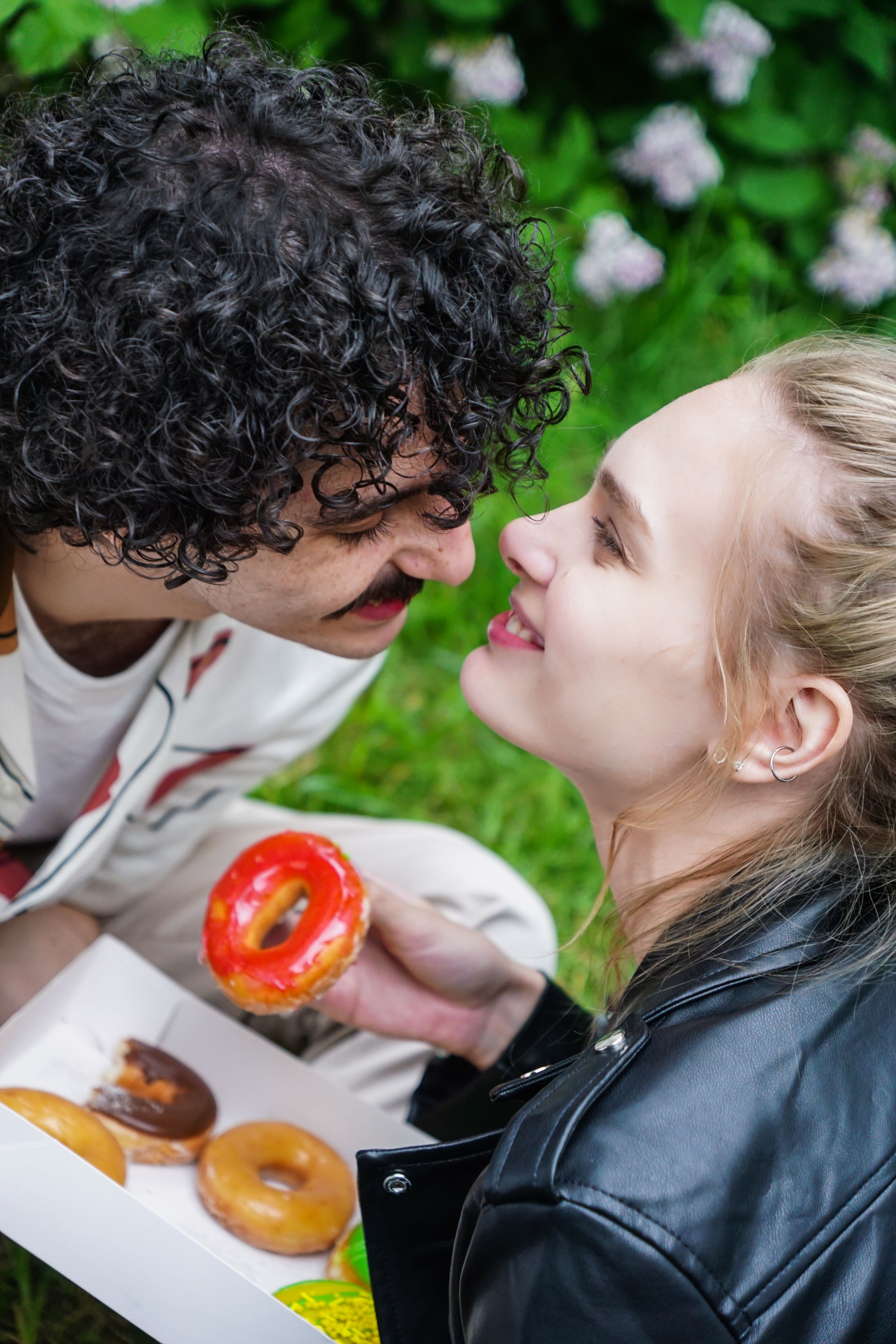 Photo of a Man with Curly Hair Kissing a Woman · Free Stock Photo