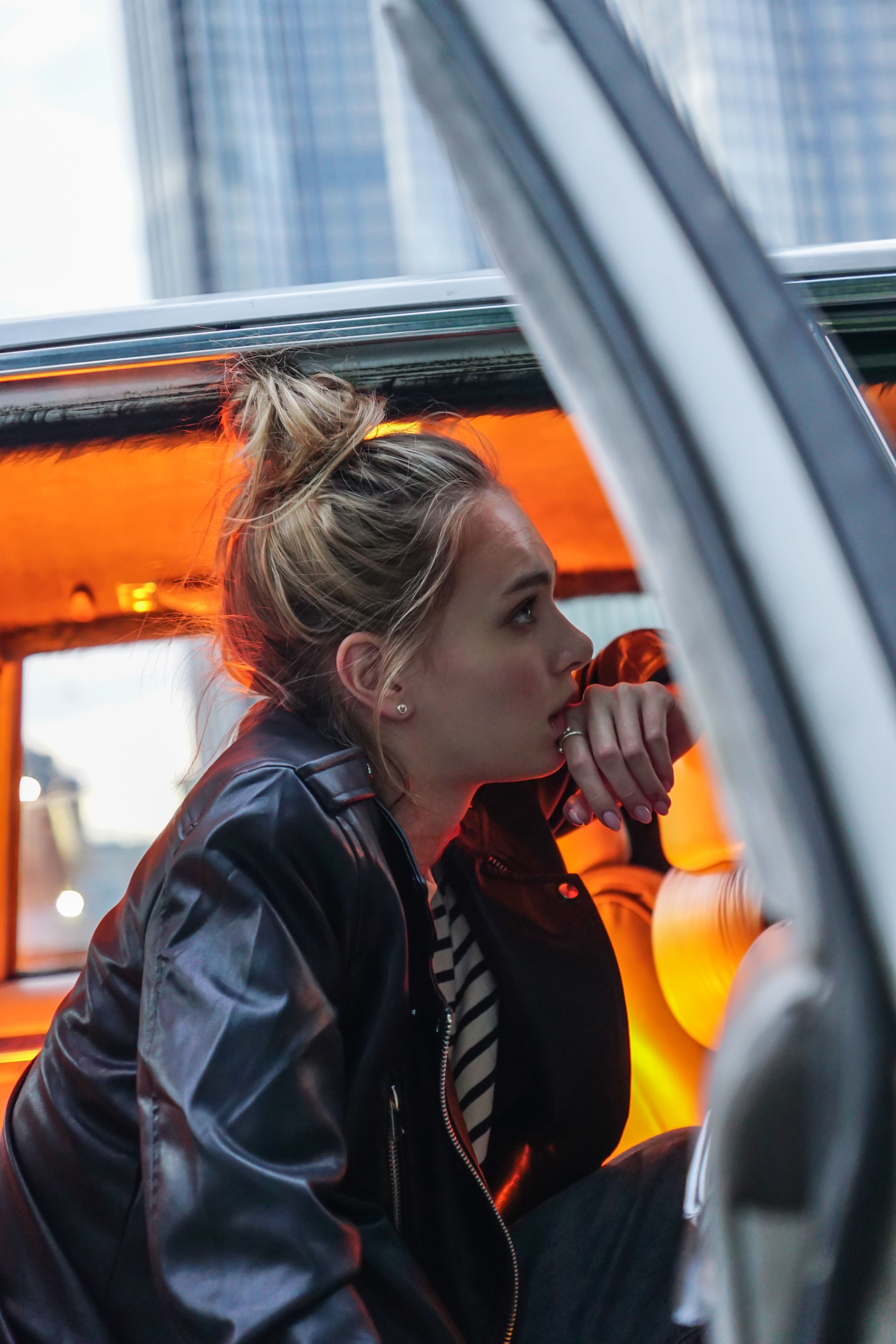 Side View of a Woman Wearing Black Leather Jacket · Free Stock Photo