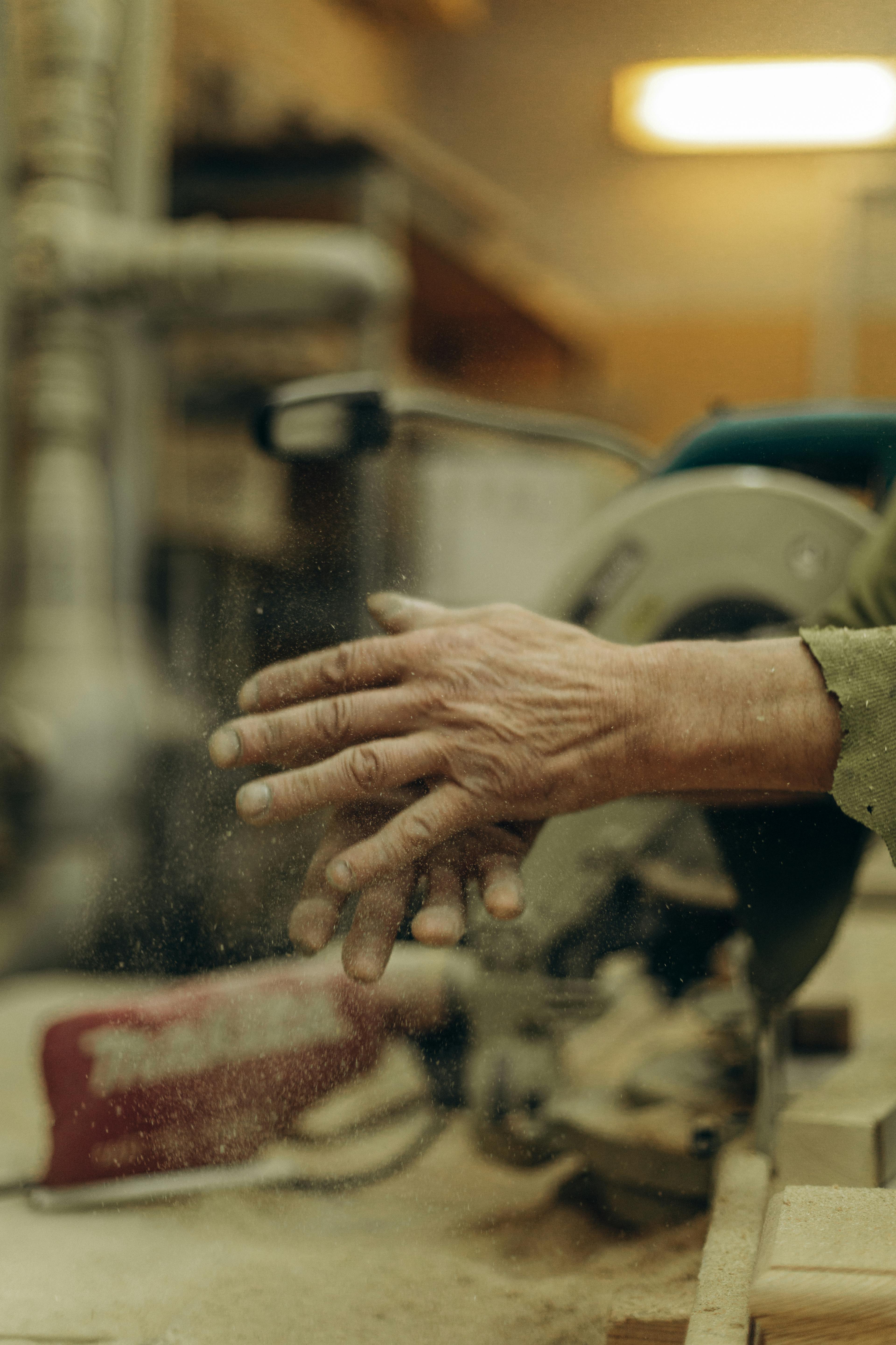 Close-Up Photo of a Person Shaking Dust from Hands · Free Stock Photo
