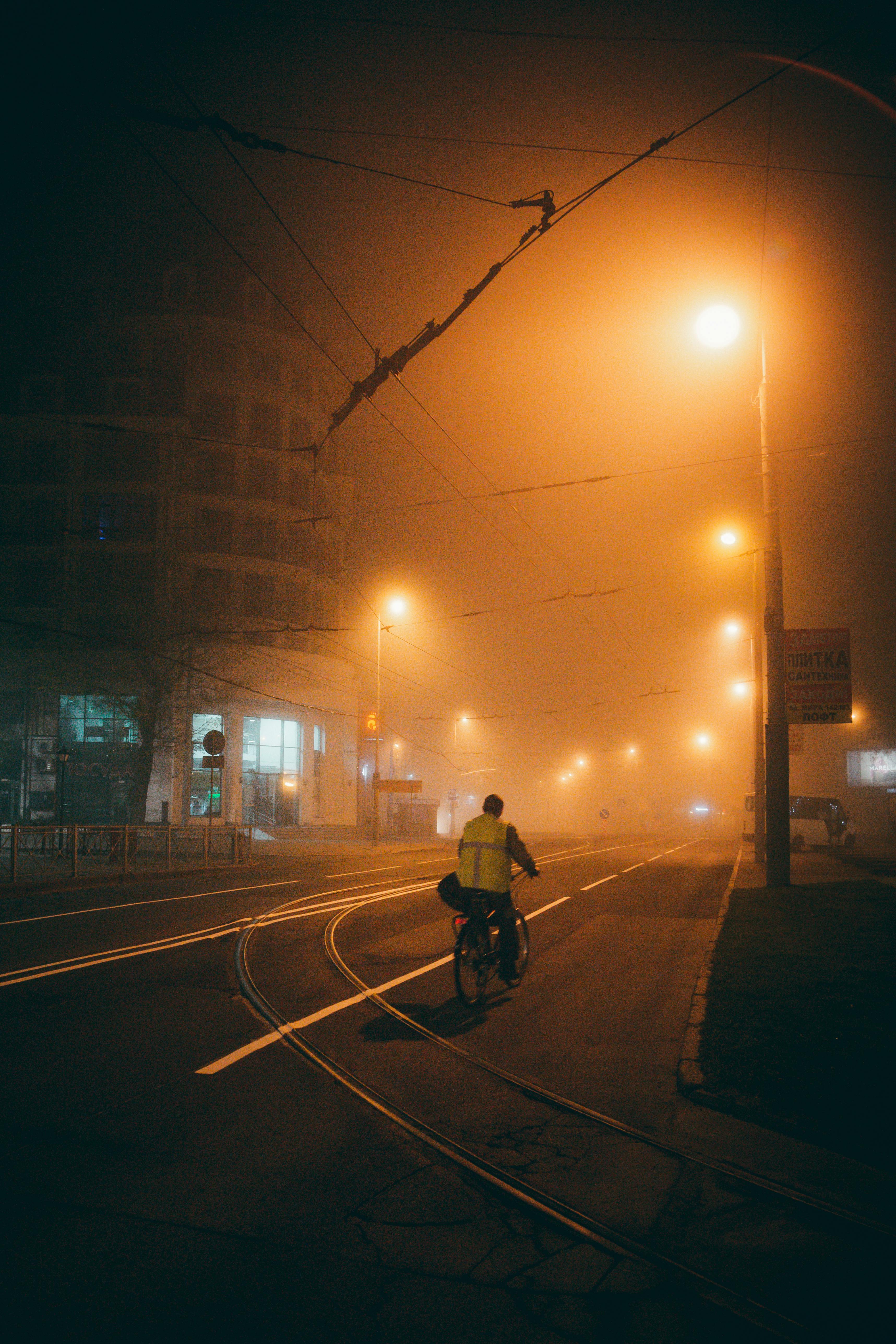 Person Riding a Bicycle at Night · Free Stock Photo