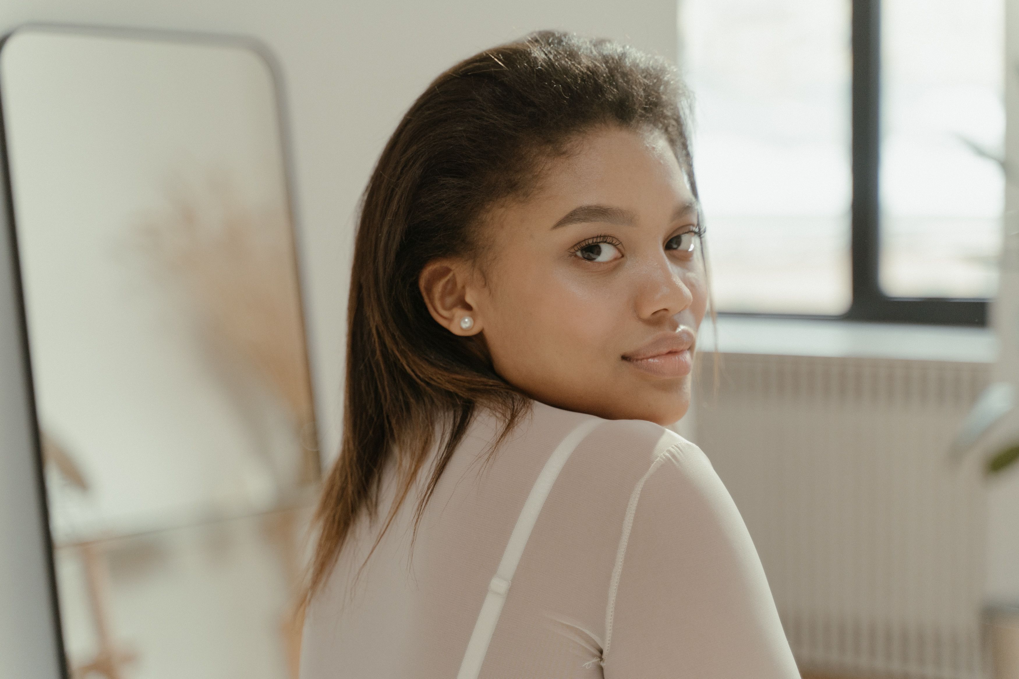 A Woman Looking Over Her Shoulder · Free Stock Photo