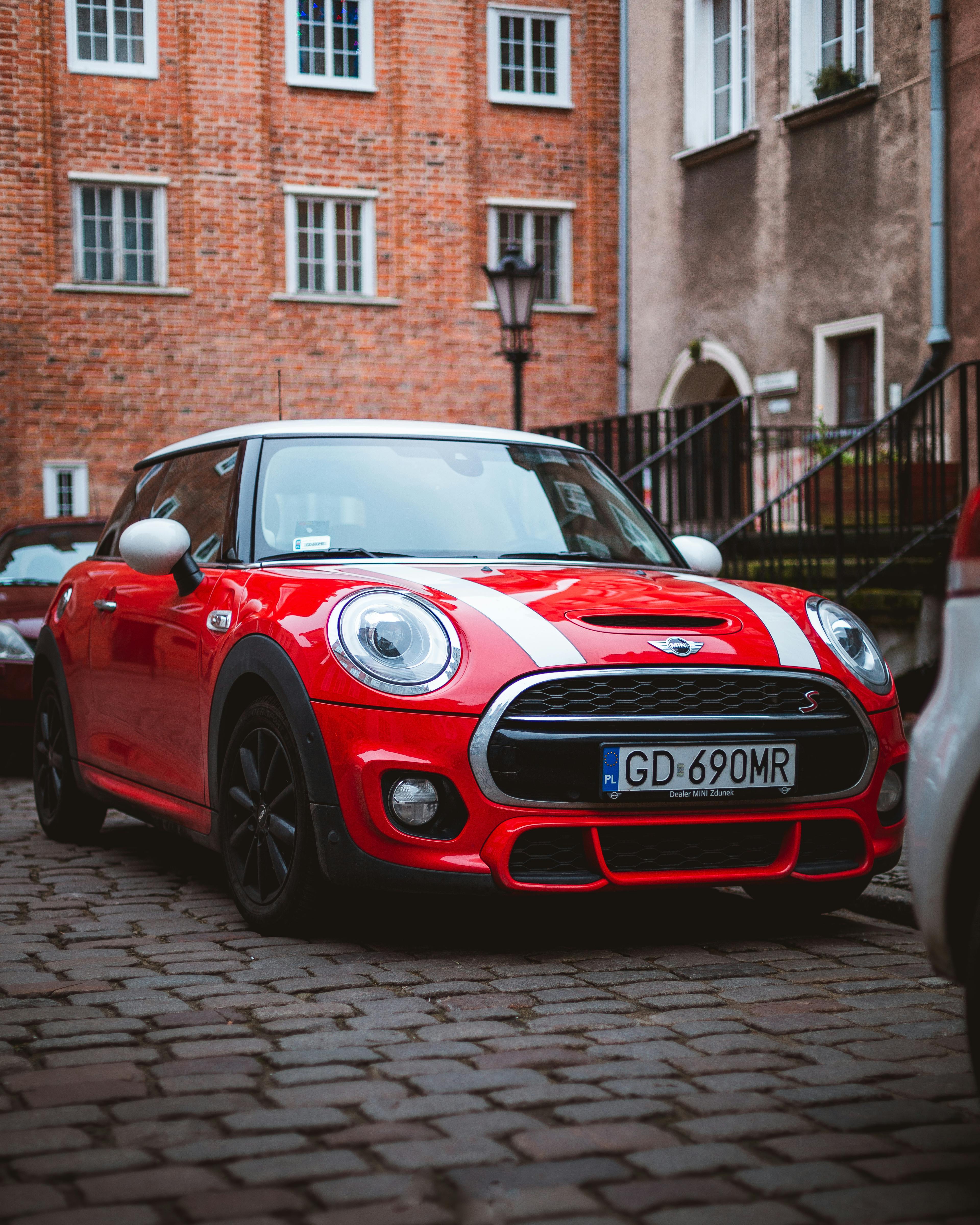 Red Mini Cooper Standing in Backyard of Building · Free Stock Photo