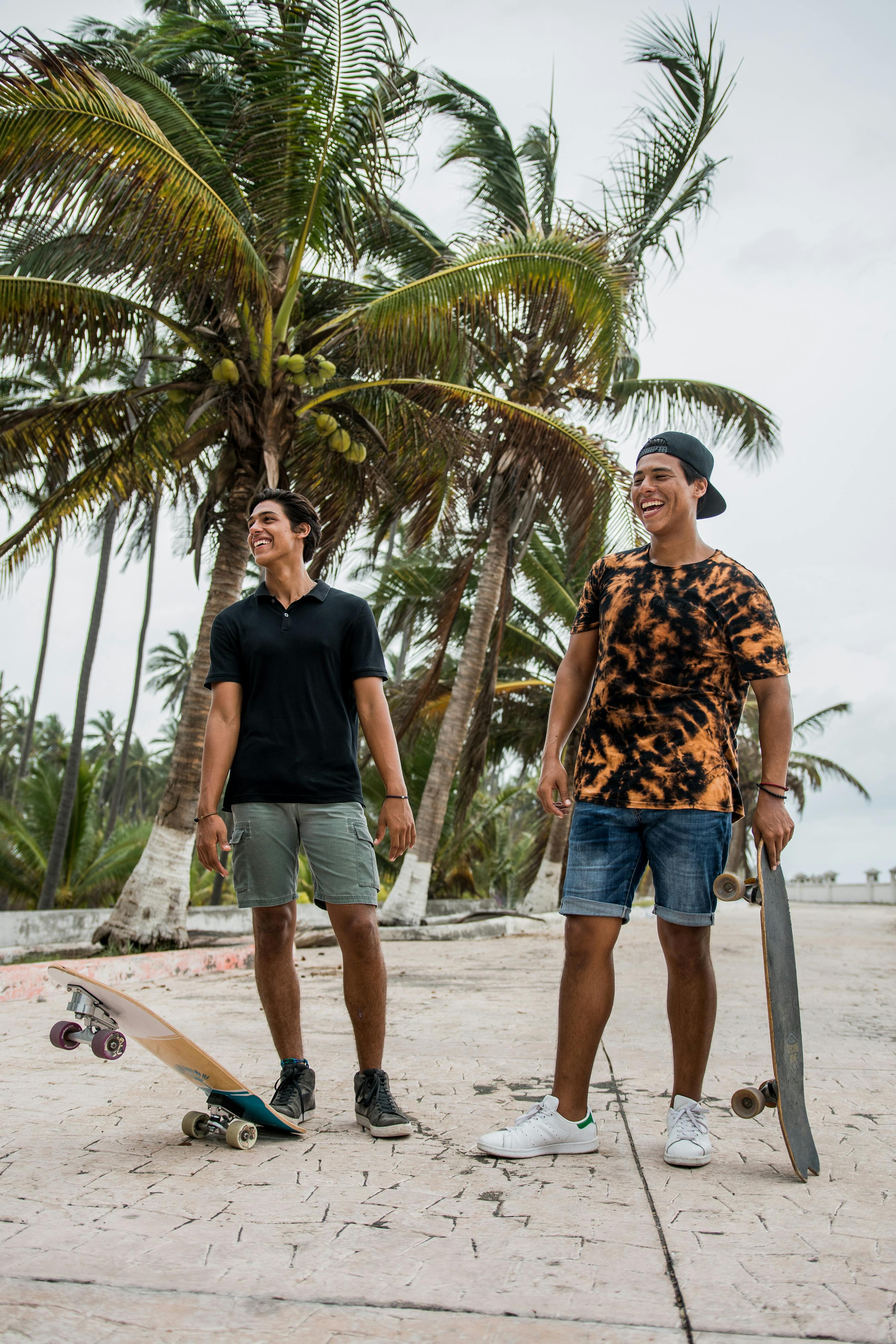 Two Happy Friends Standing Beside Each Other · Free Stock Photo