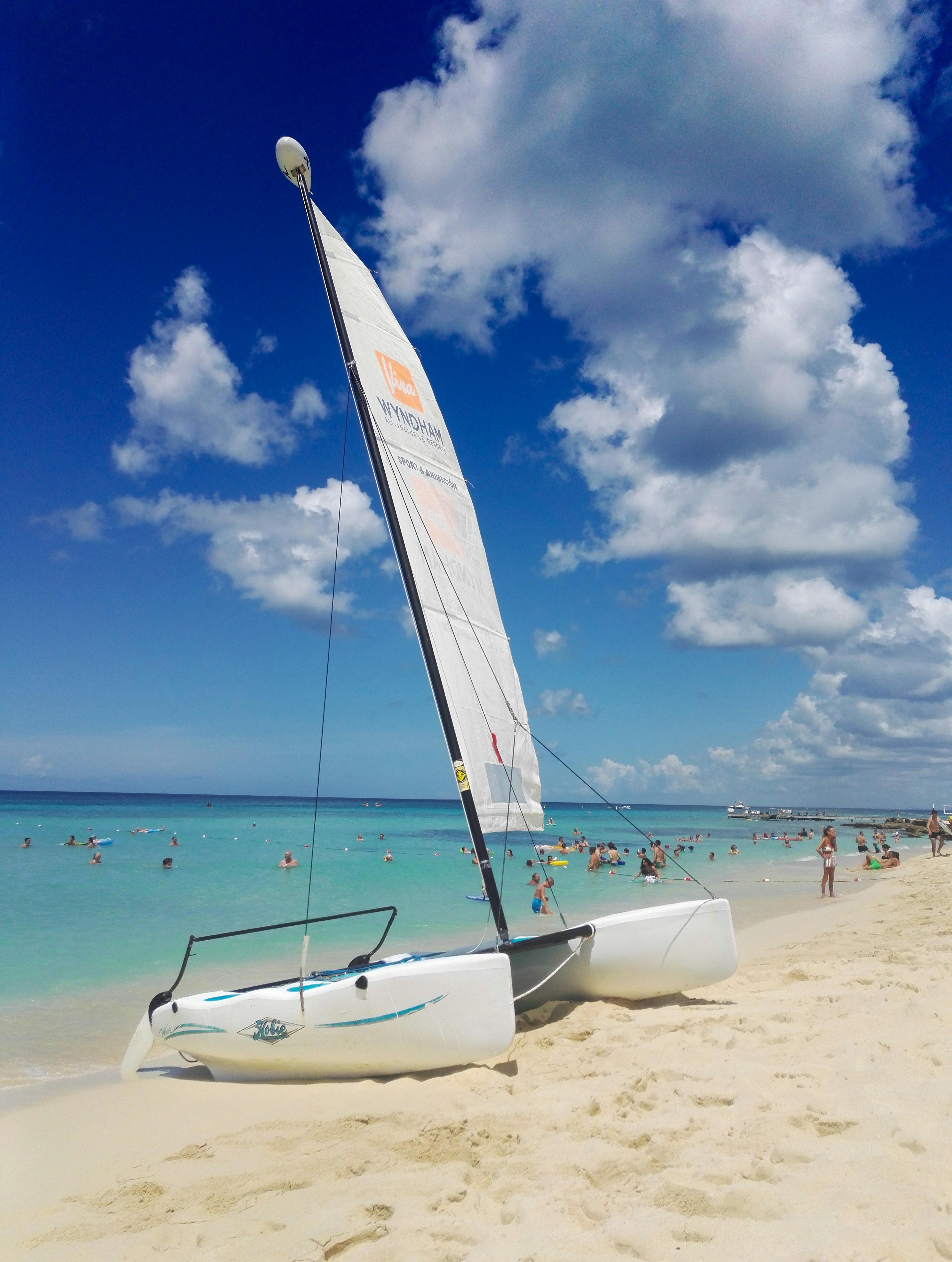A White Sailboat on the Beach · Free Stock Photo