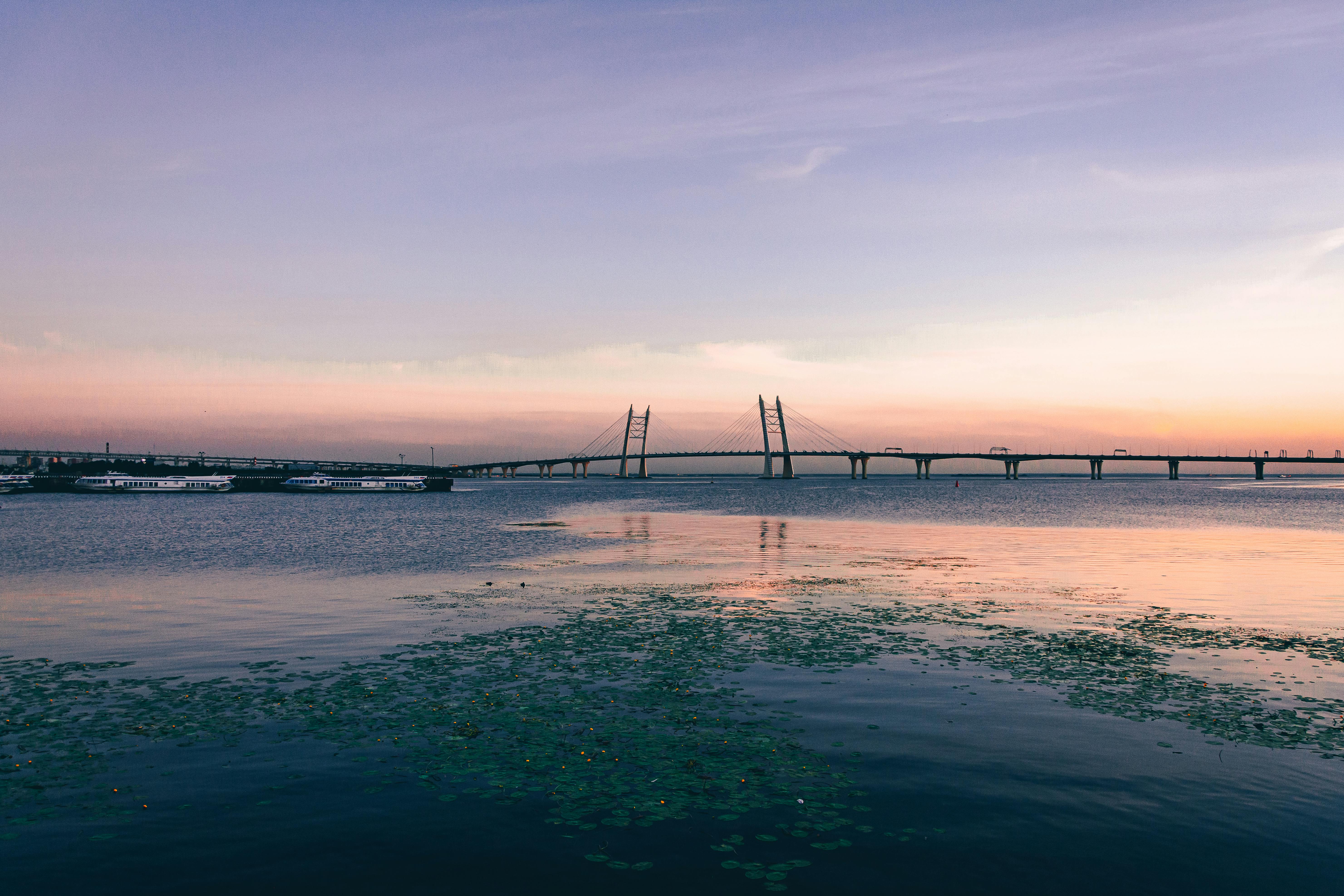 Sunrise over Bridge on Sea Shore · Free Stock Photo
