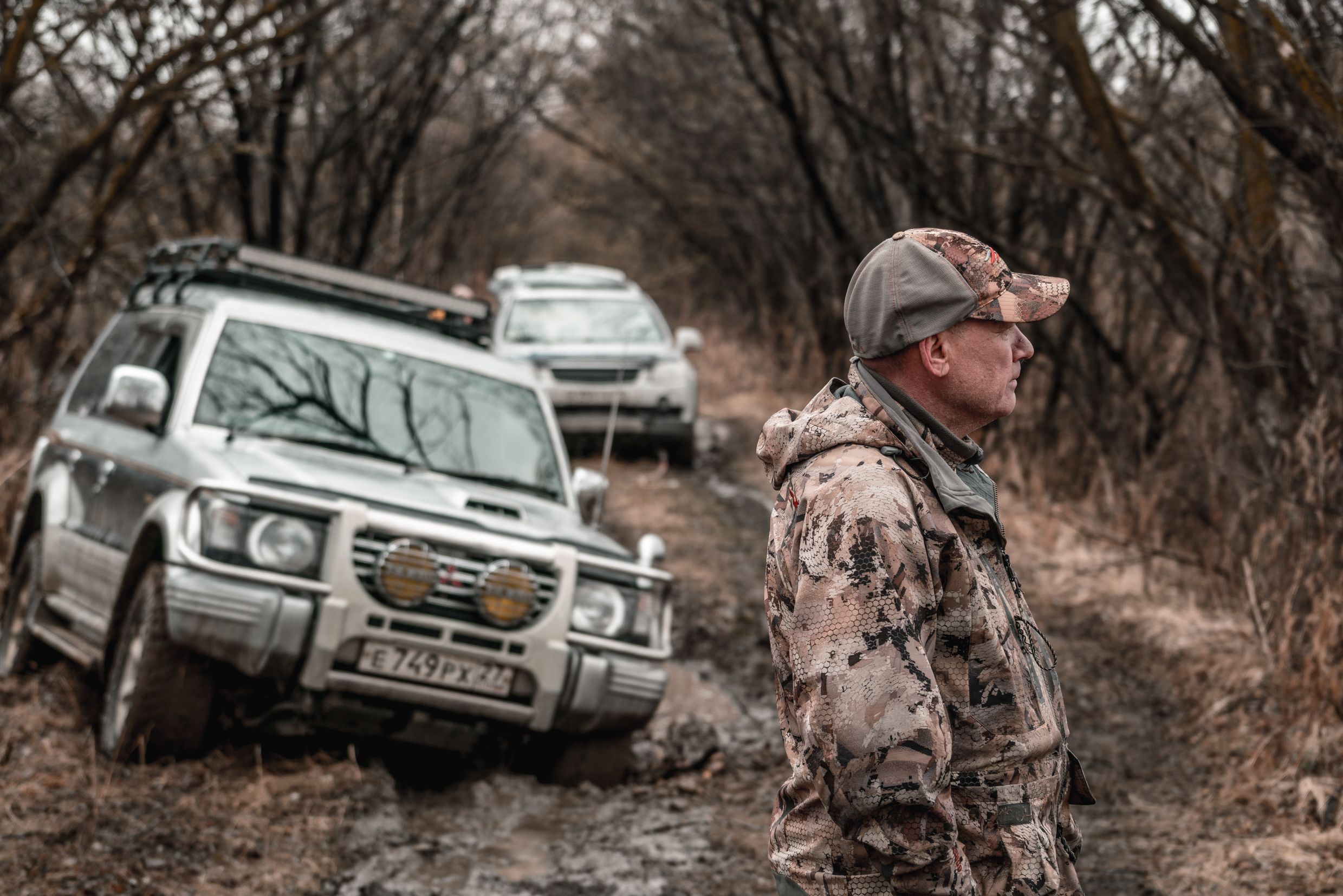 Man Off-road with His Car Stuck in Mud · Free Stock Photo