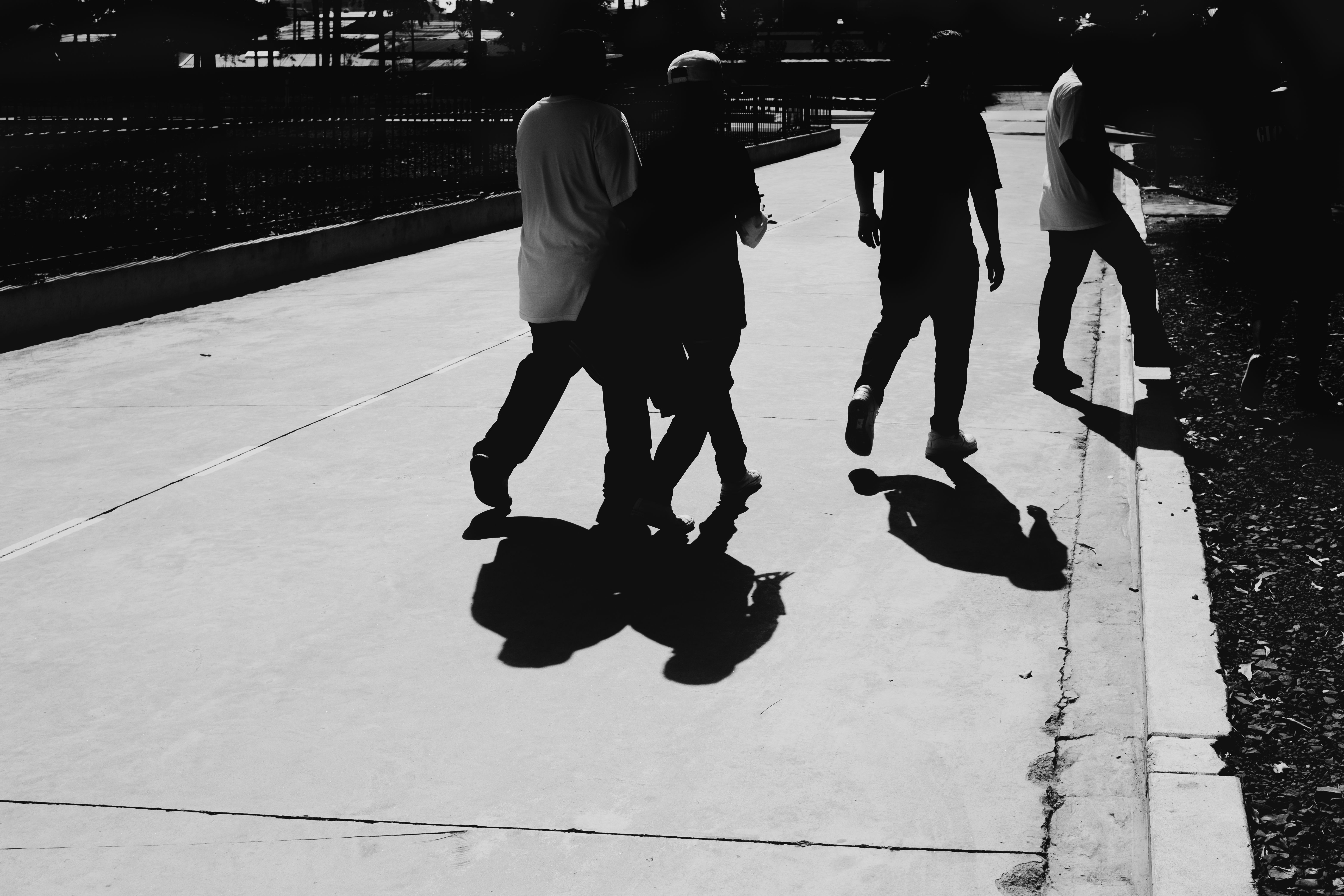 Monochrome Photo of People walking on Pavement · Free Stock Photo
