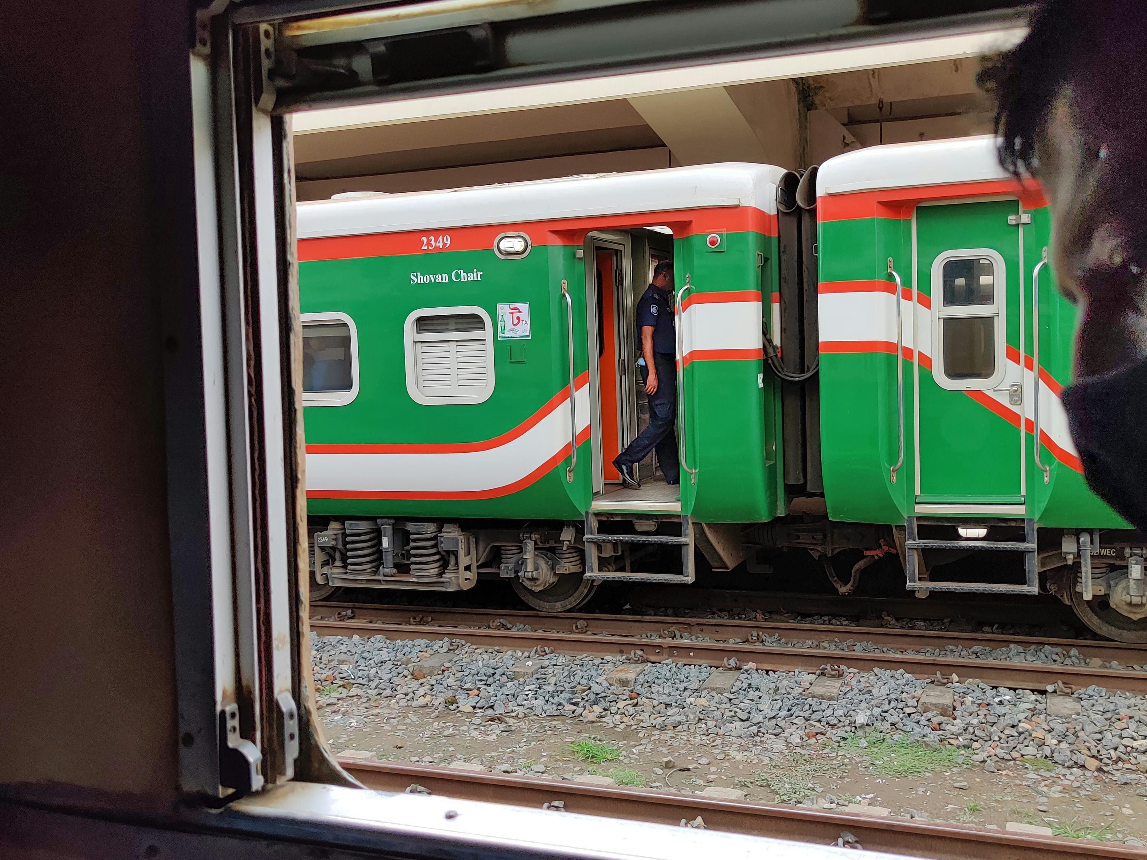 Passenger Sitting by a Window in a Train · Free Stock Photo