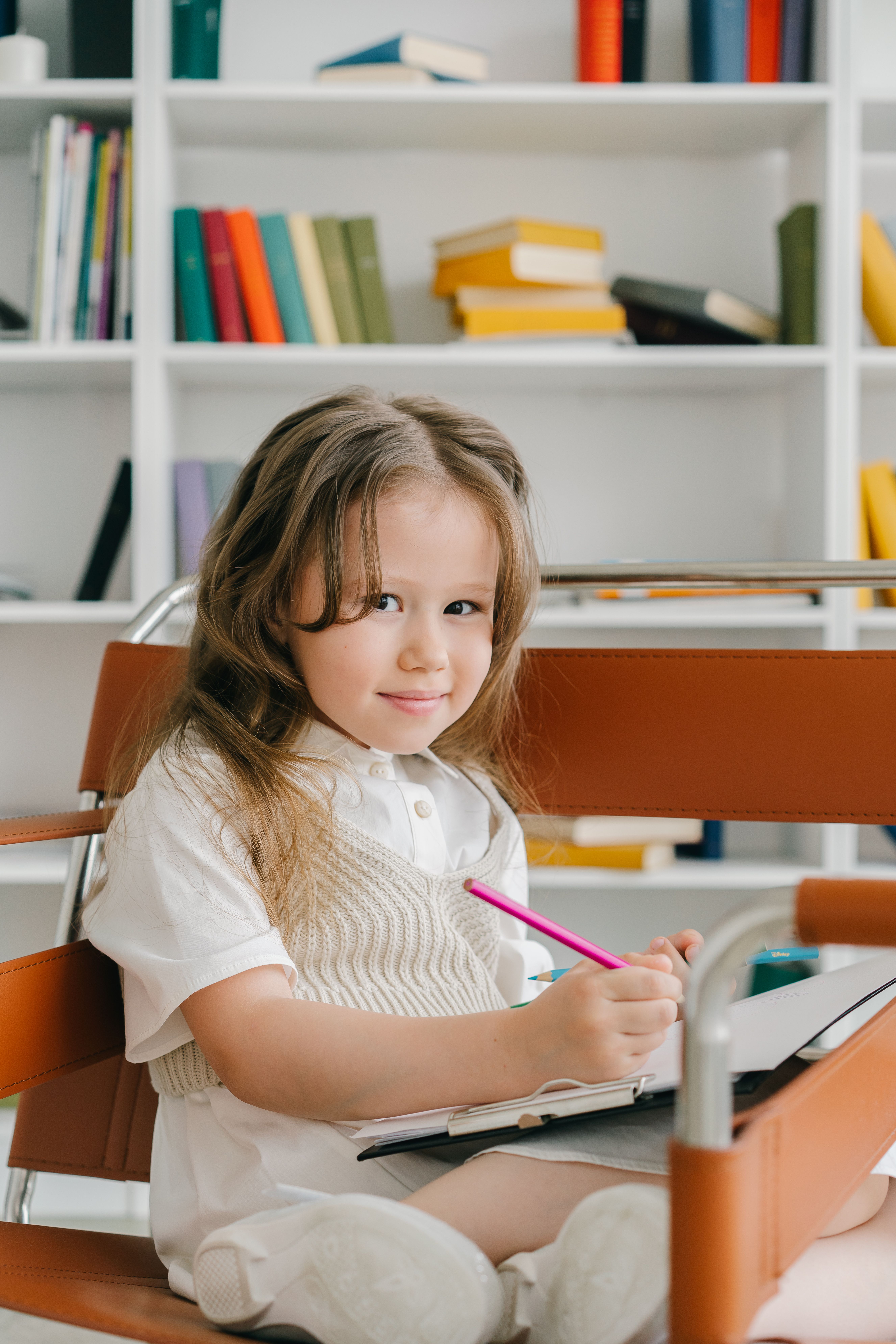 Photo of a Kid Using a Pink Pencil to Write · Free Stock Photo