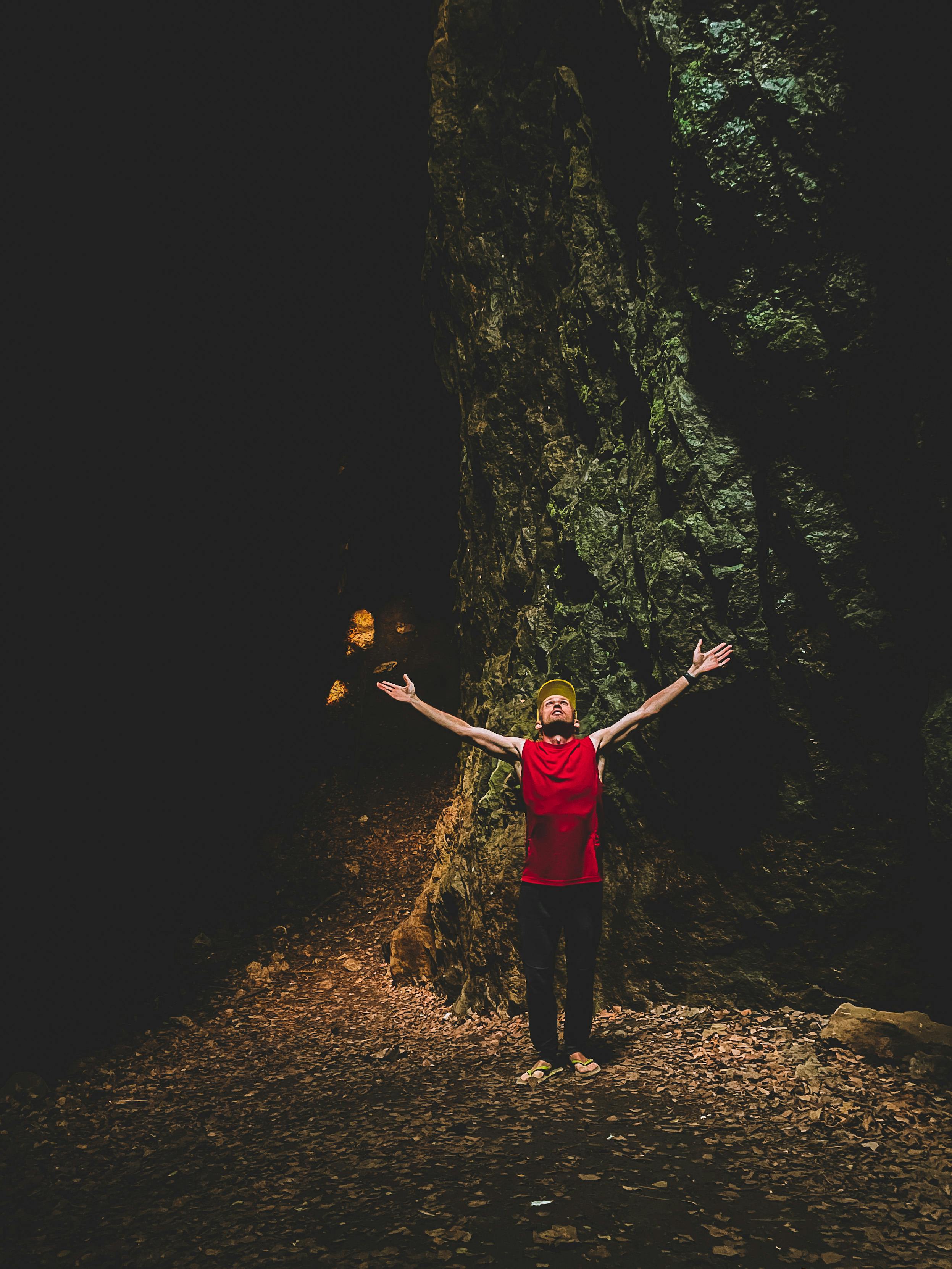 A Person Standing inside the Cave · Free Stock Photo