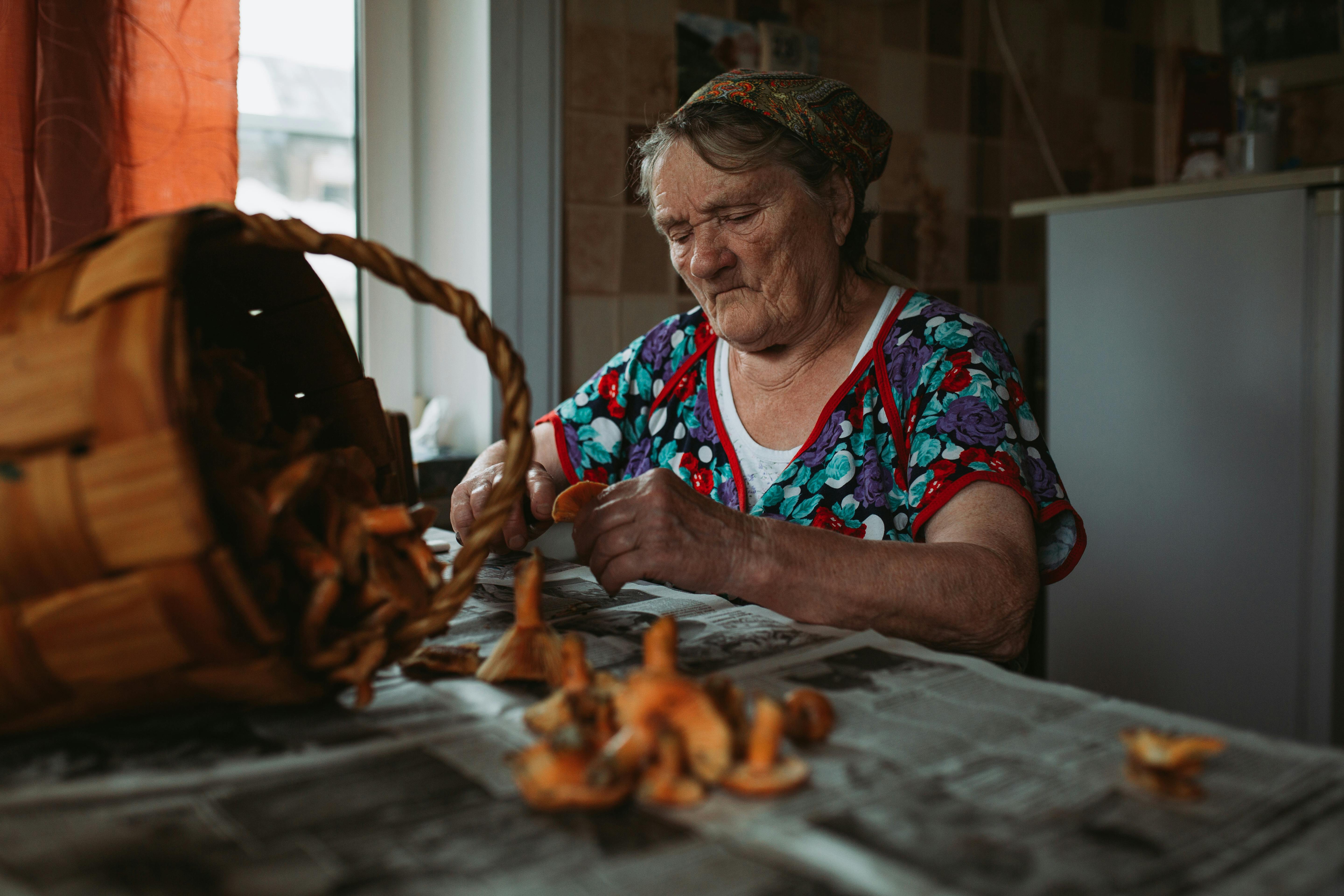 An Elderly Woman Making a Handicraft · Free Stock Photo