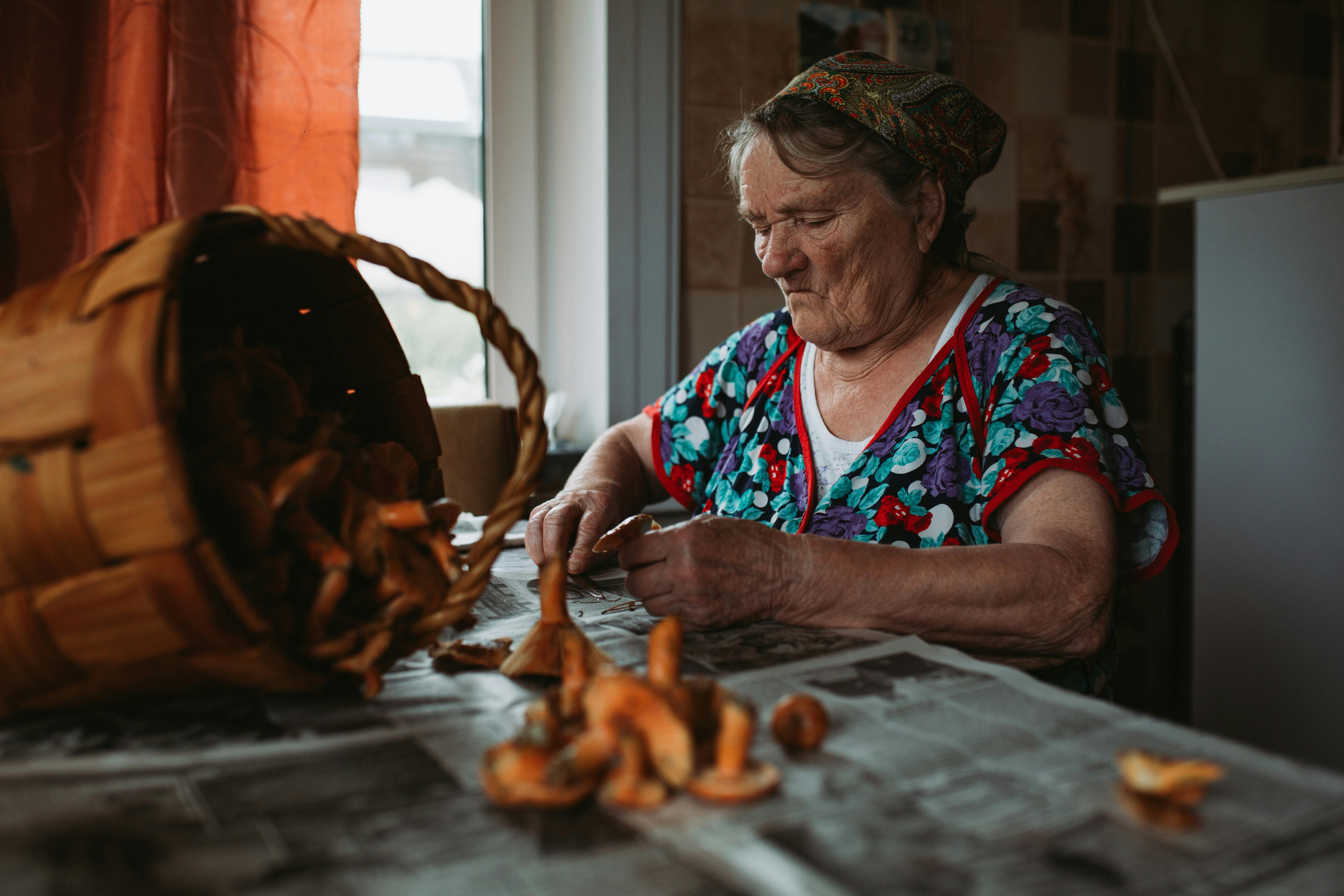 An Elderly Woman Making a Handicraft · Free Stock Photo