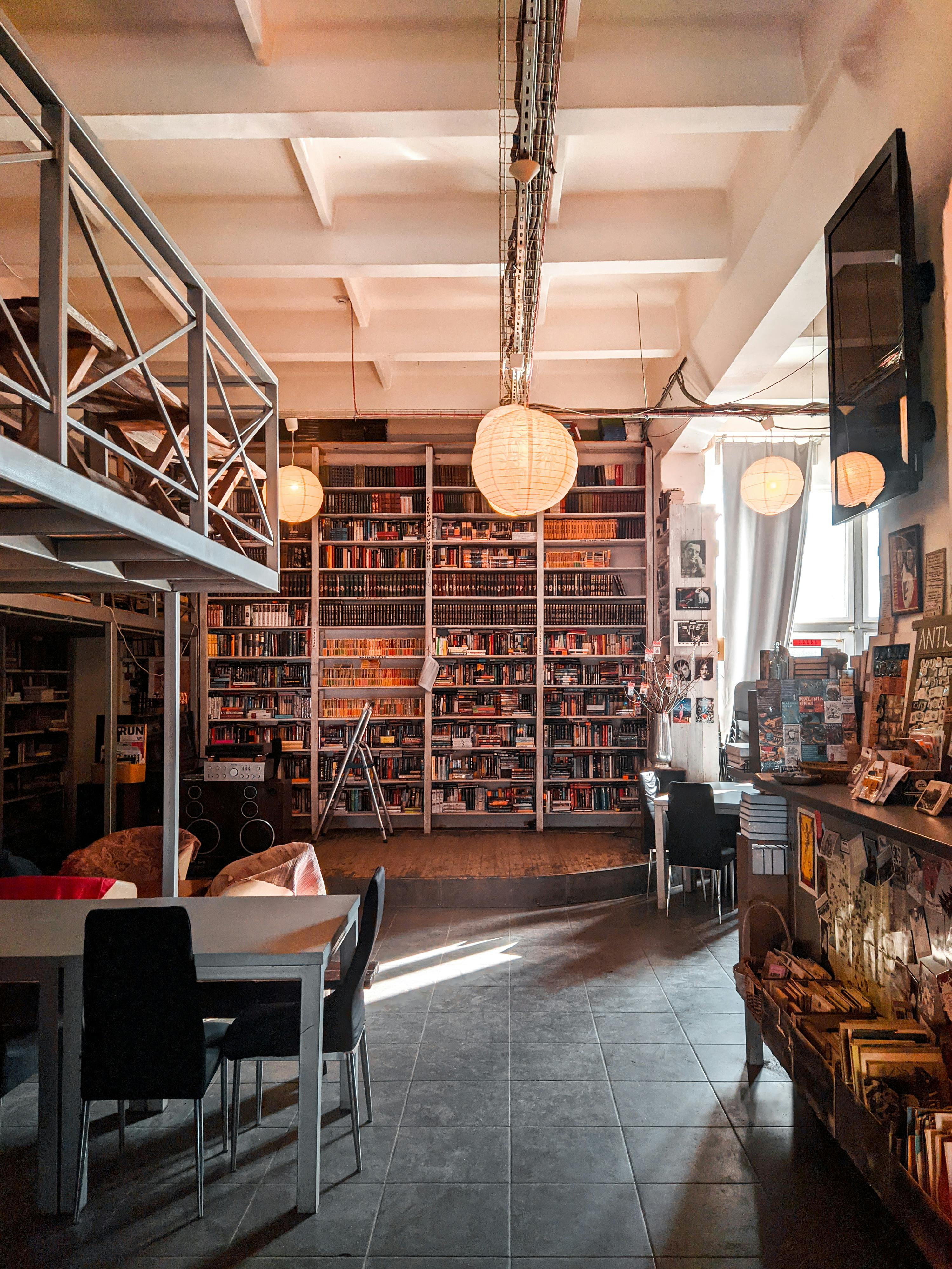 Bookcase with Books and Cameras. · Free Stock Photo
