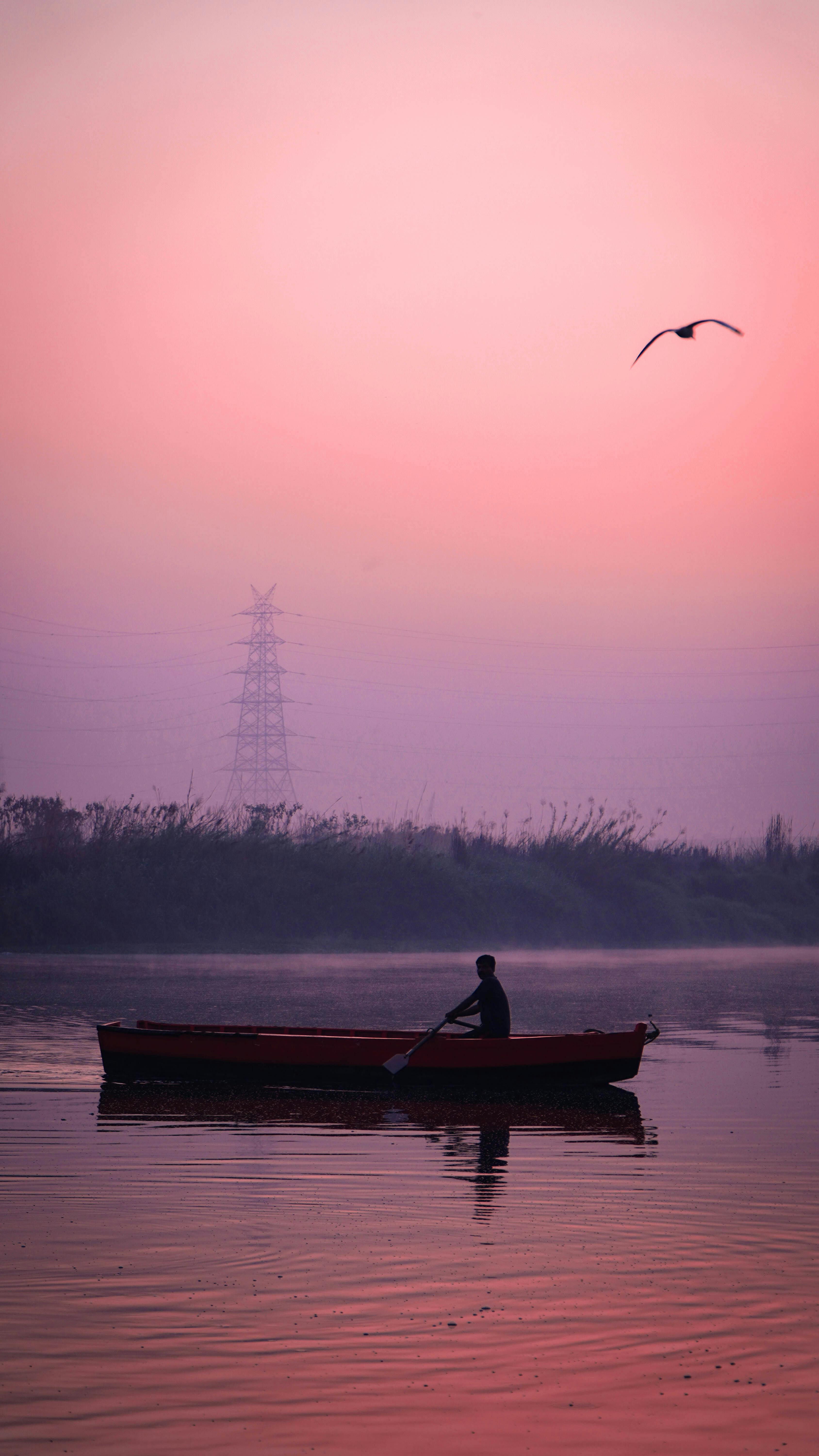 Man Riding on a Boat · Free Stock Photo