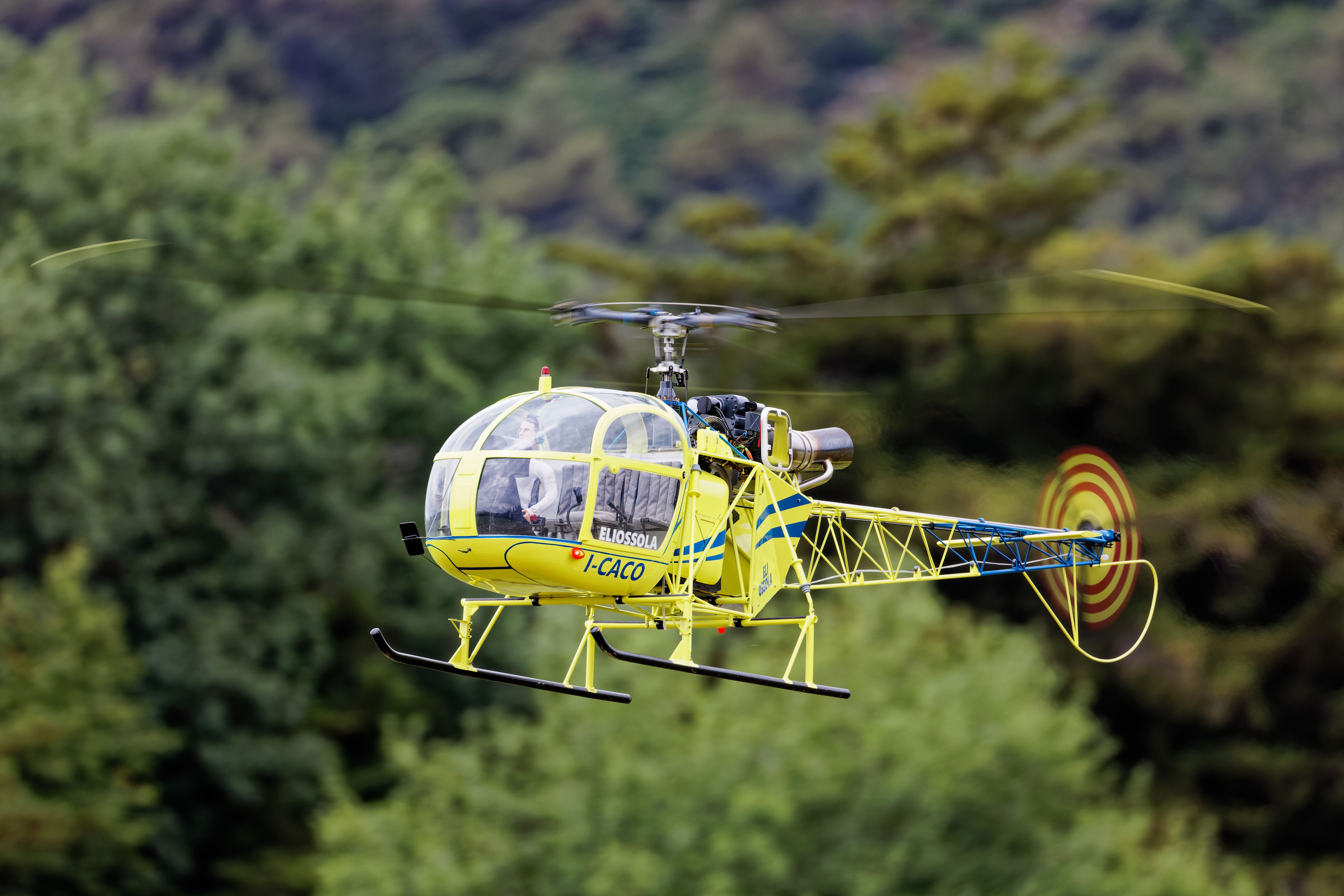 Photo of a Yellow and Blue Radio-Controlled Helicopter · Free Stock Photo
