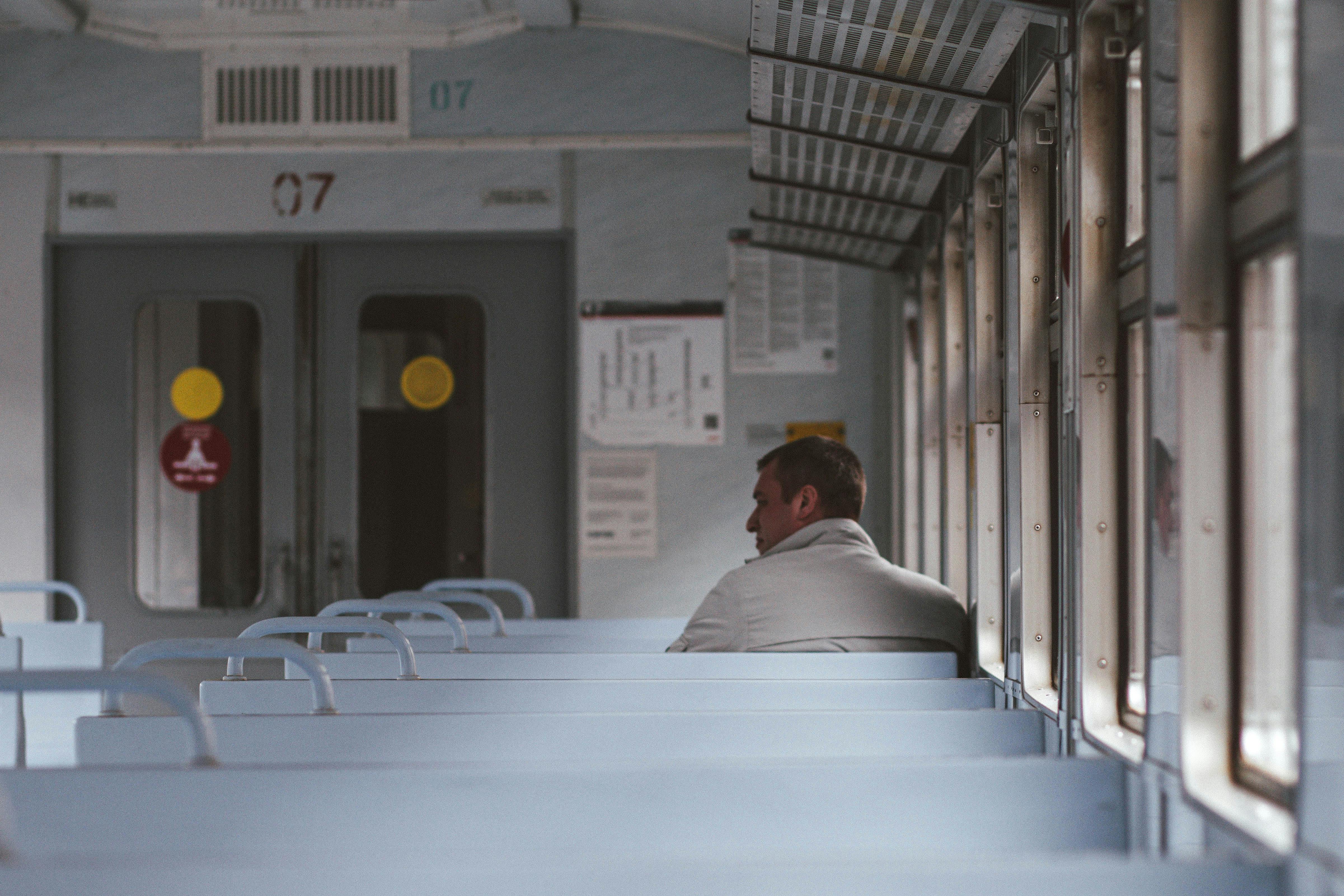 Back View of a Man Sitting in a Train · Free Stock Photo