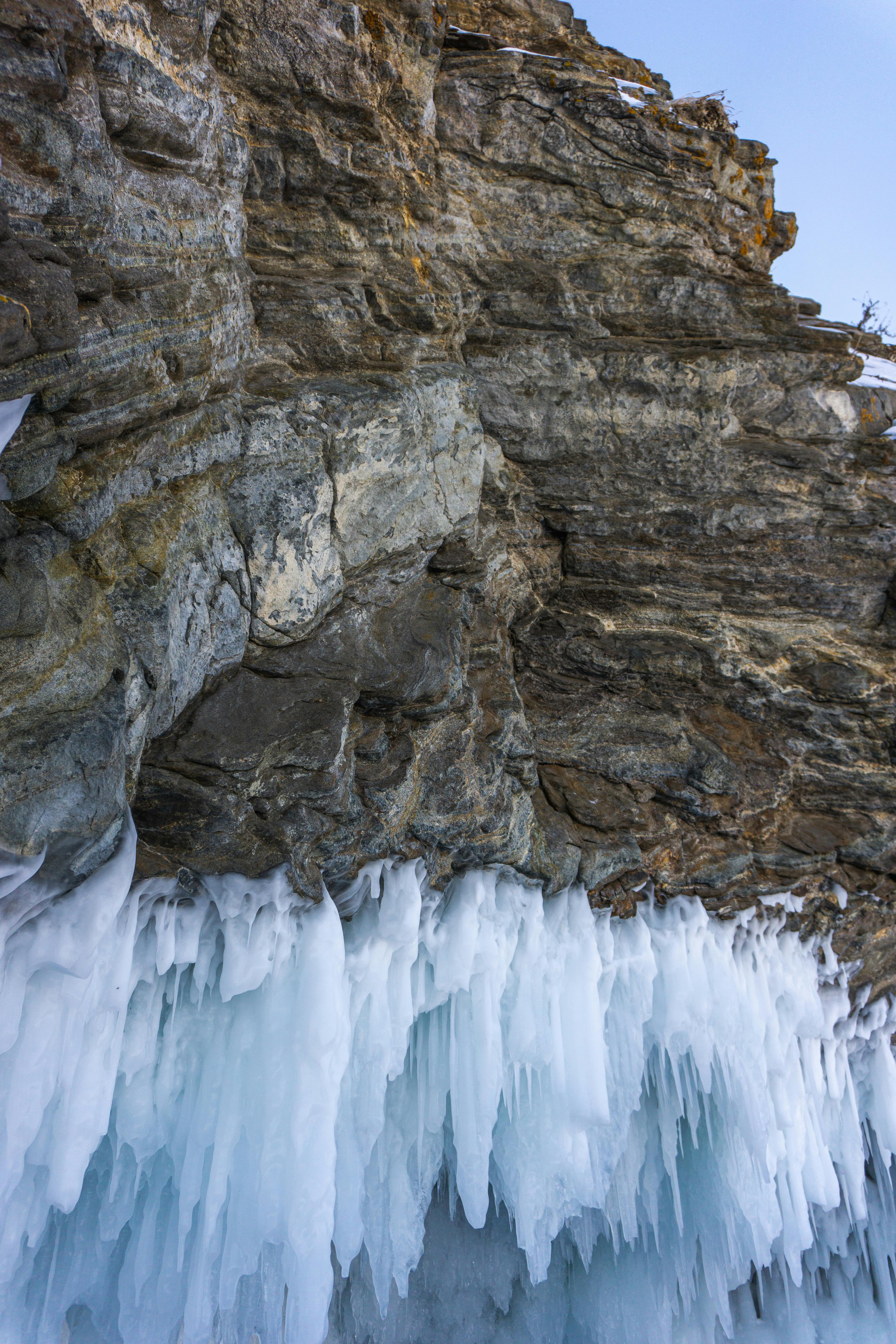 Salt Stalactites Hanging from Rock Wall · Free Stock Photo