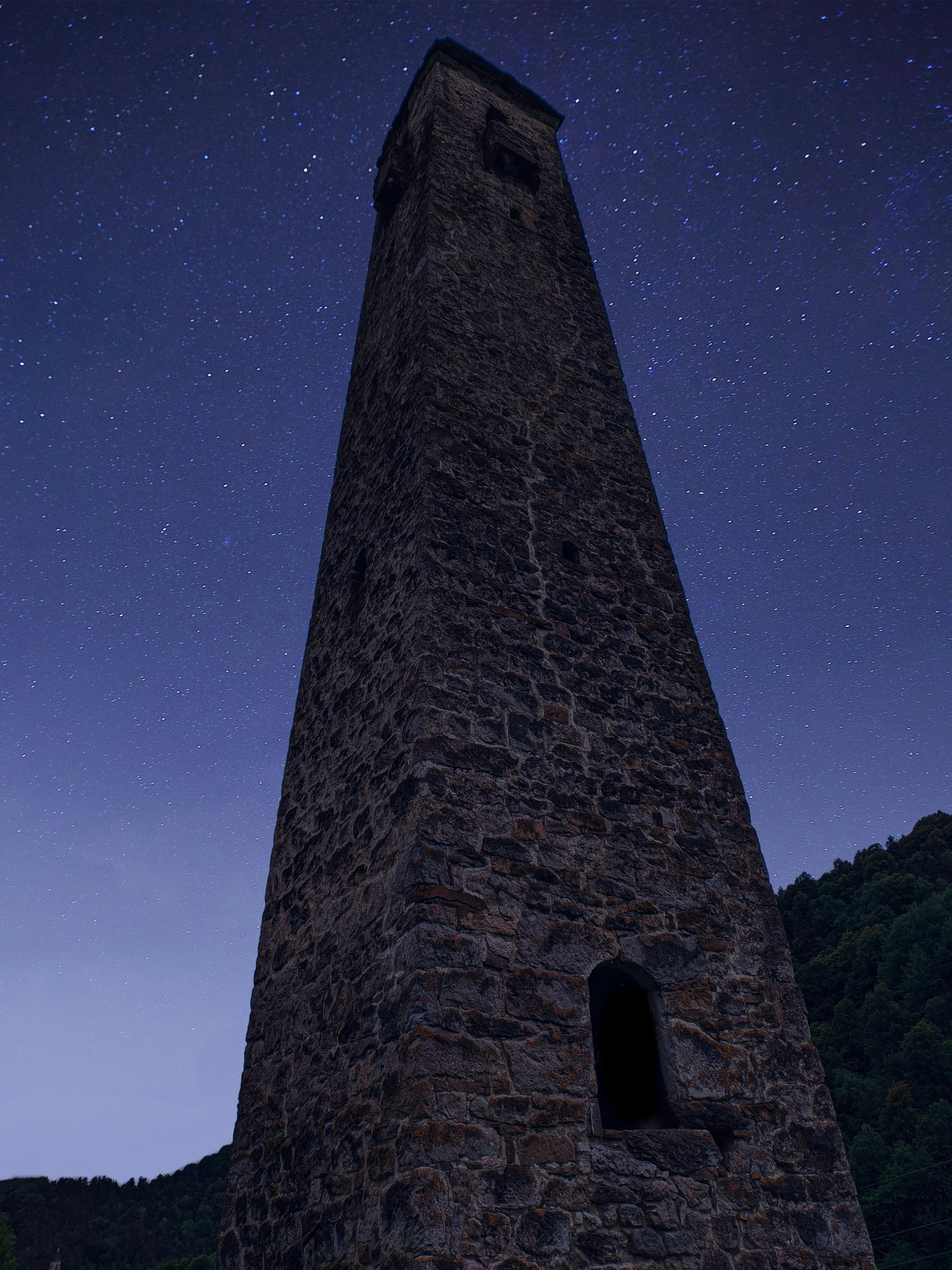 Low-Angle Shot of a Concrete Tower at Night · Free Stock Photo