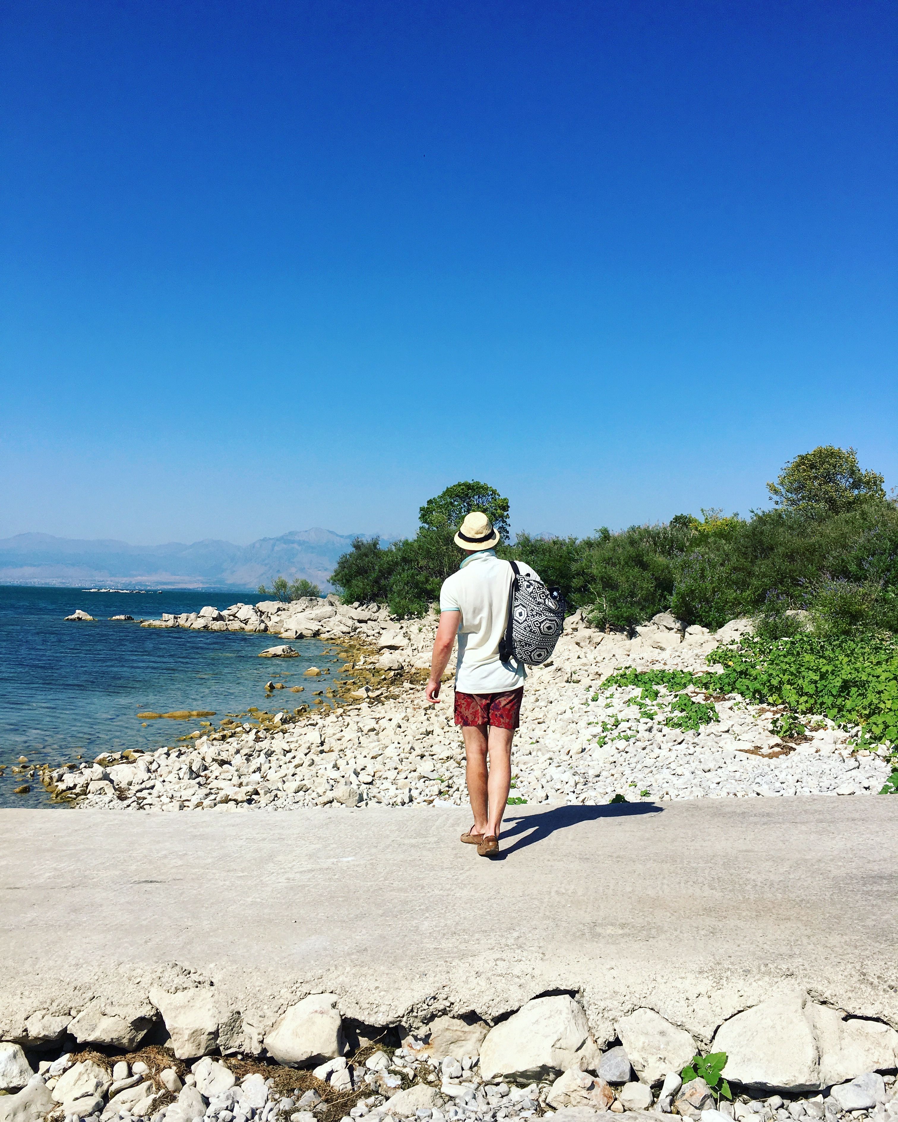 Man Walking on Beach on Summer Day · Free Stock Photo