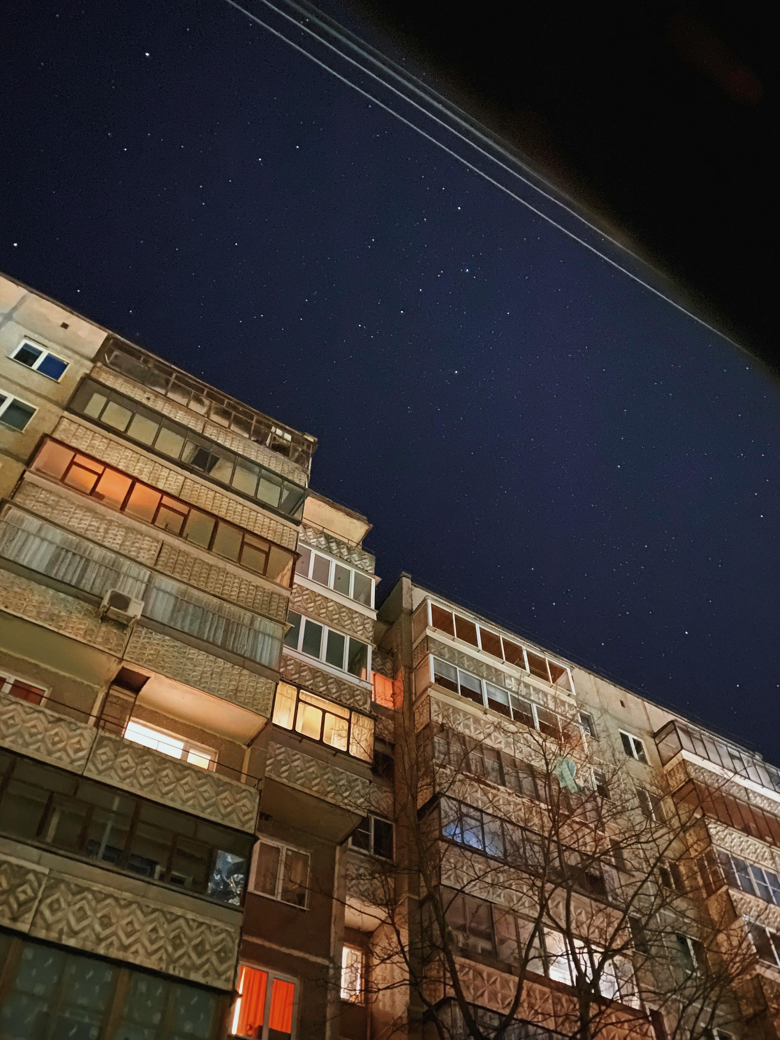 Buildings Under the Starry Night Sky · Free Stock Photo
