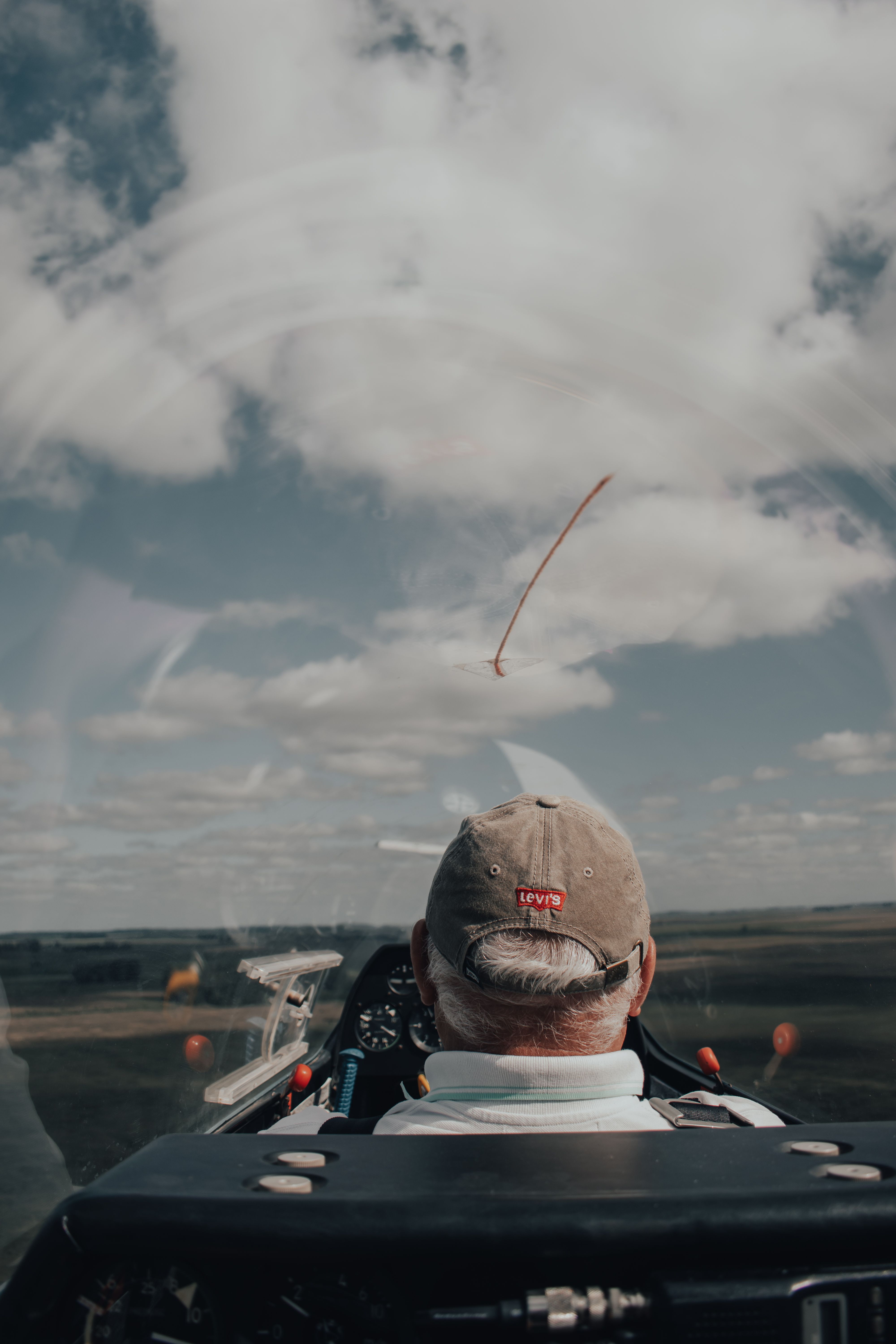 Pilot in Brown Cap Riding Aircraft · Free Stock Photo