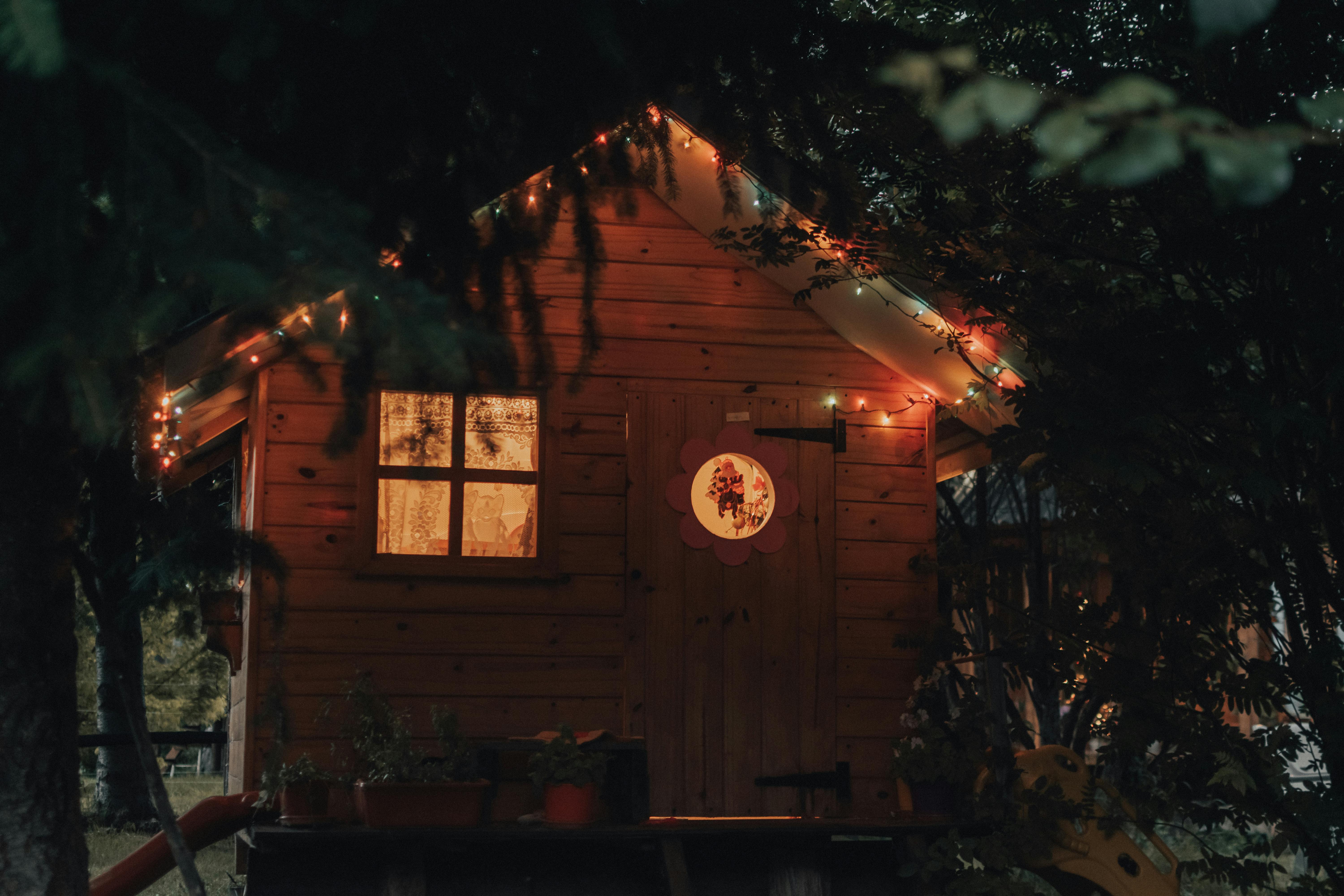 Wooden Cabin Illuminated with Christmas Lights · Free Stock Photo