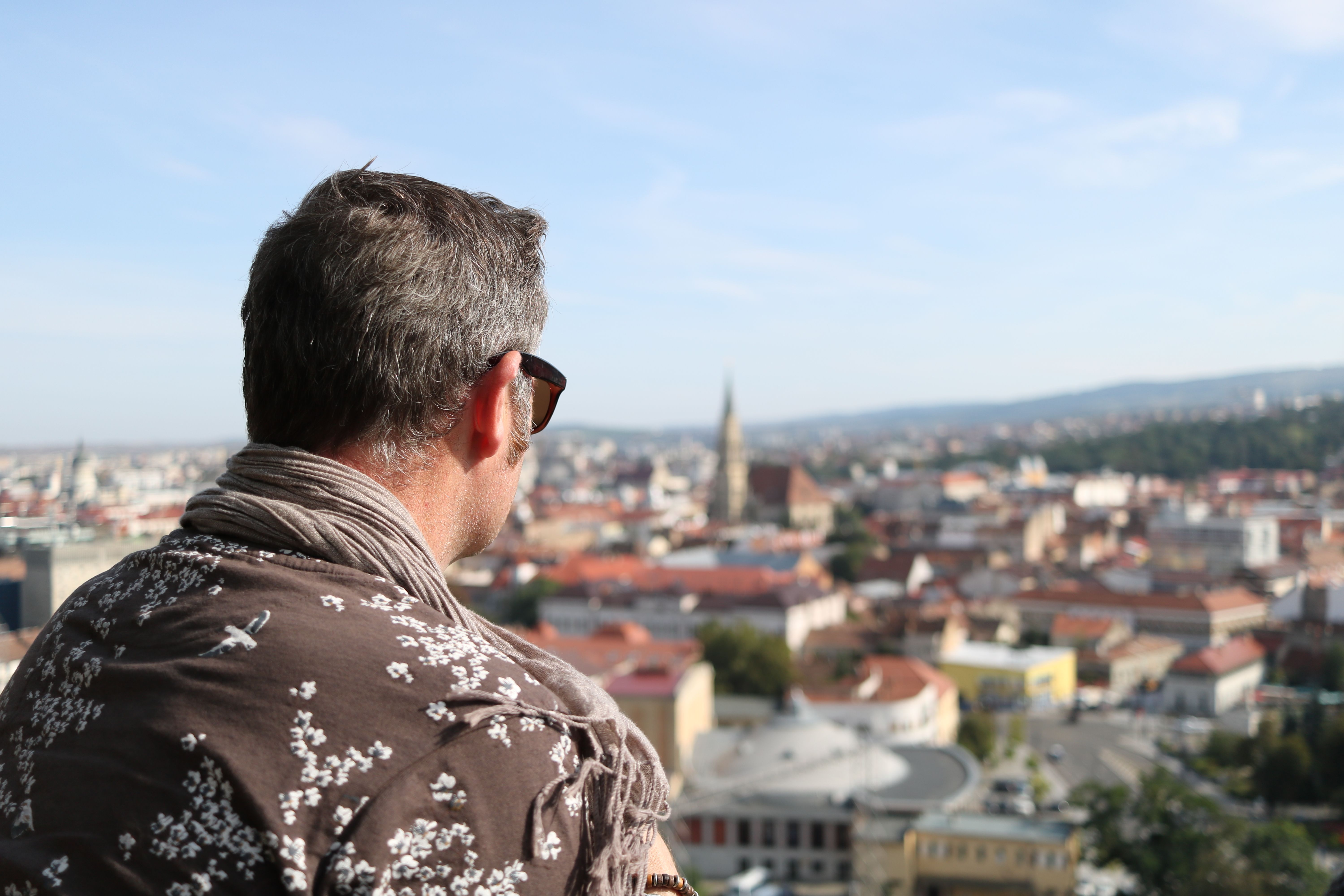 Person Wearing Blue Adidas Backpack Standing Near Buildings · Free ...