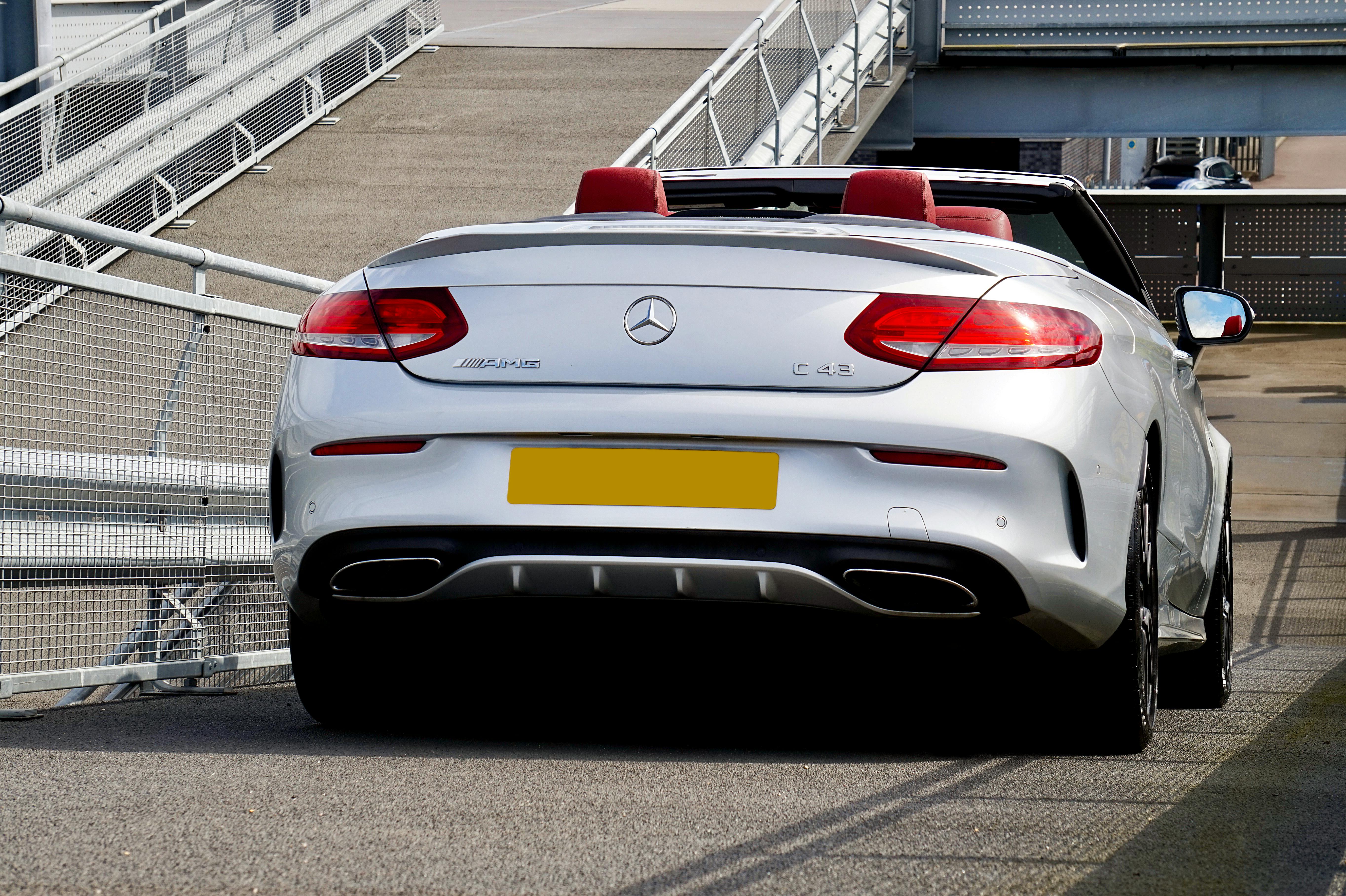 Photo of a Silver Car with Red Tail Lights · Free Stock Photo