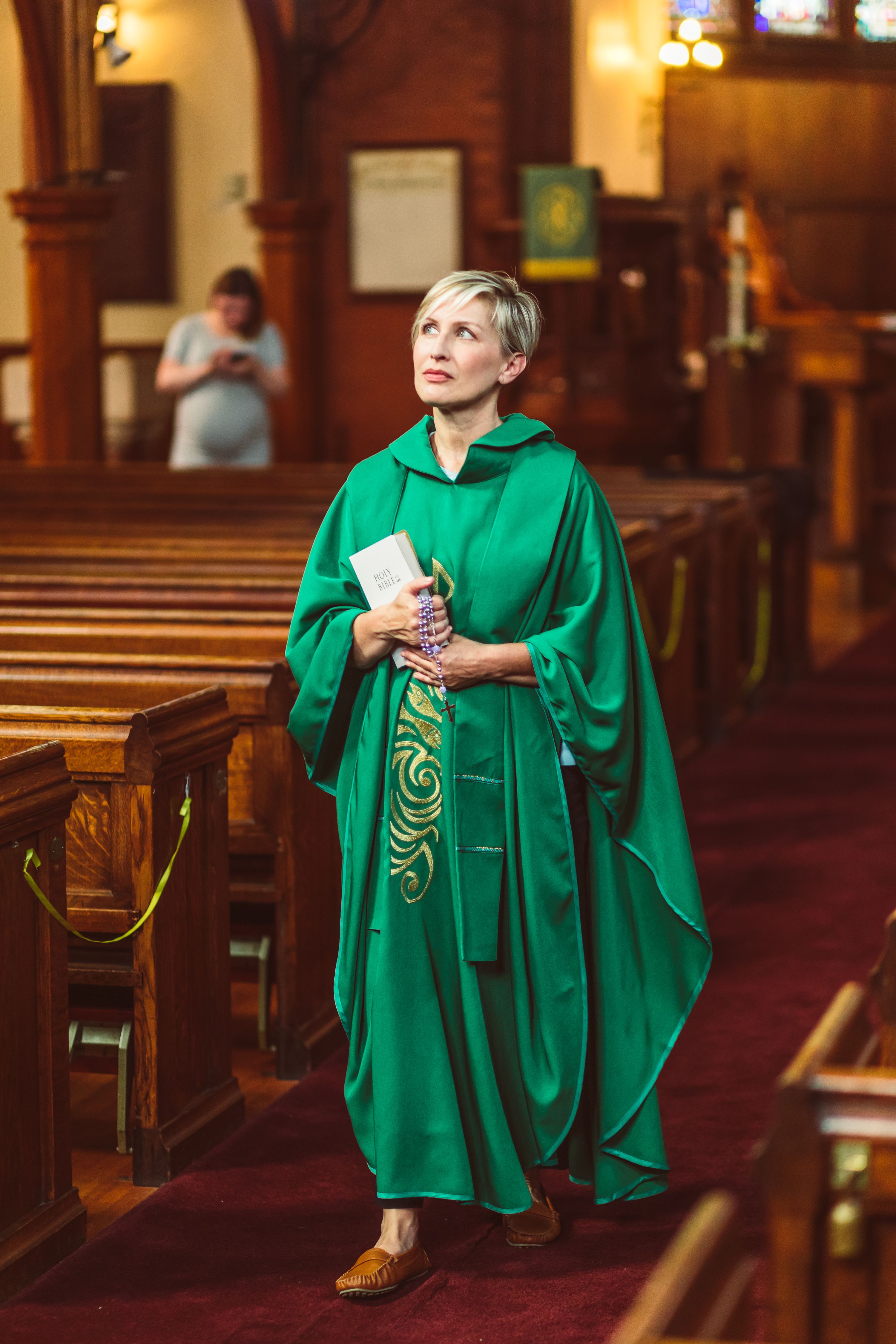 A Woman Priest Talking to Church Goers · Free Stock Photo