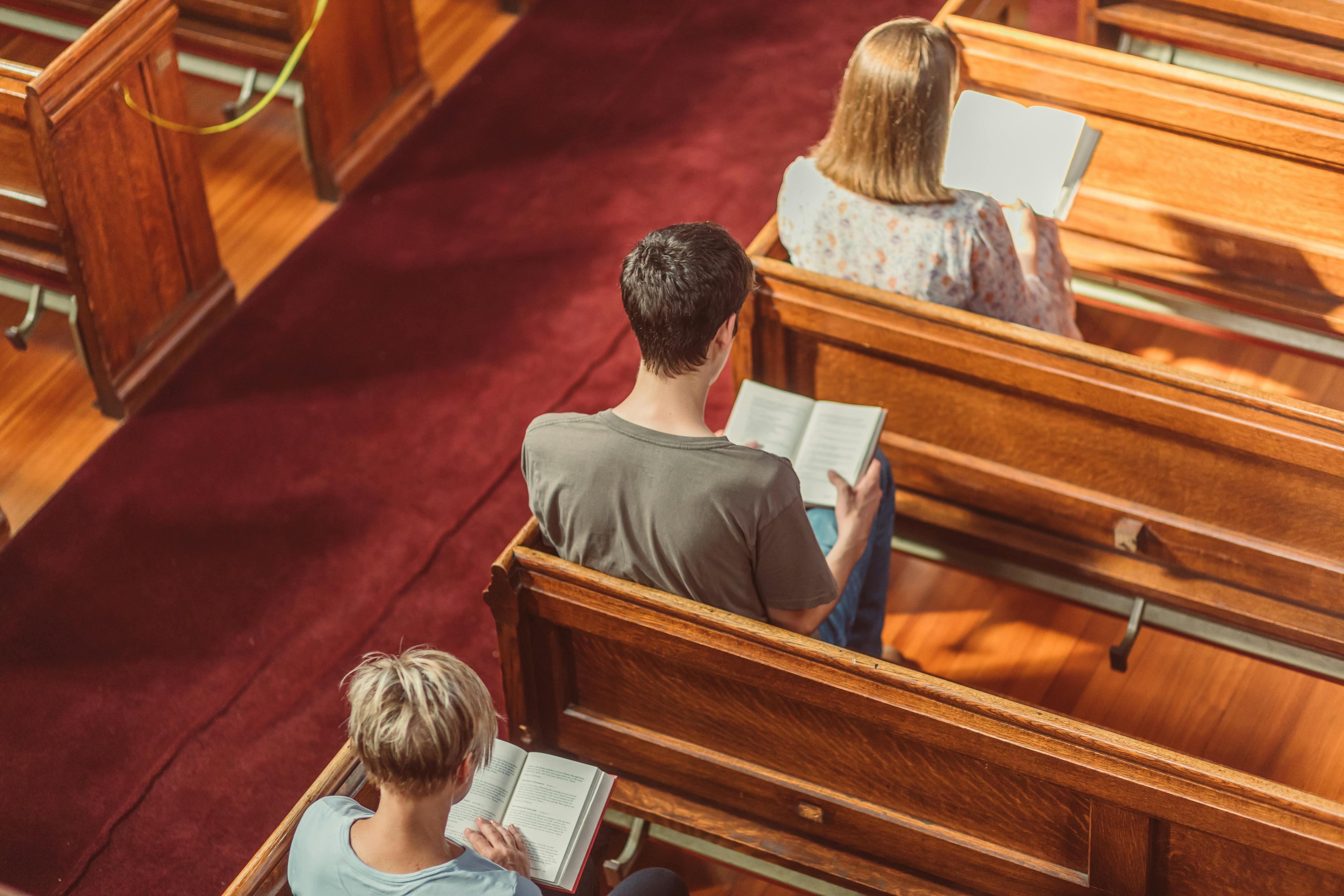 People Sitting on Wooden Table Reading Books · Free Stock Photo