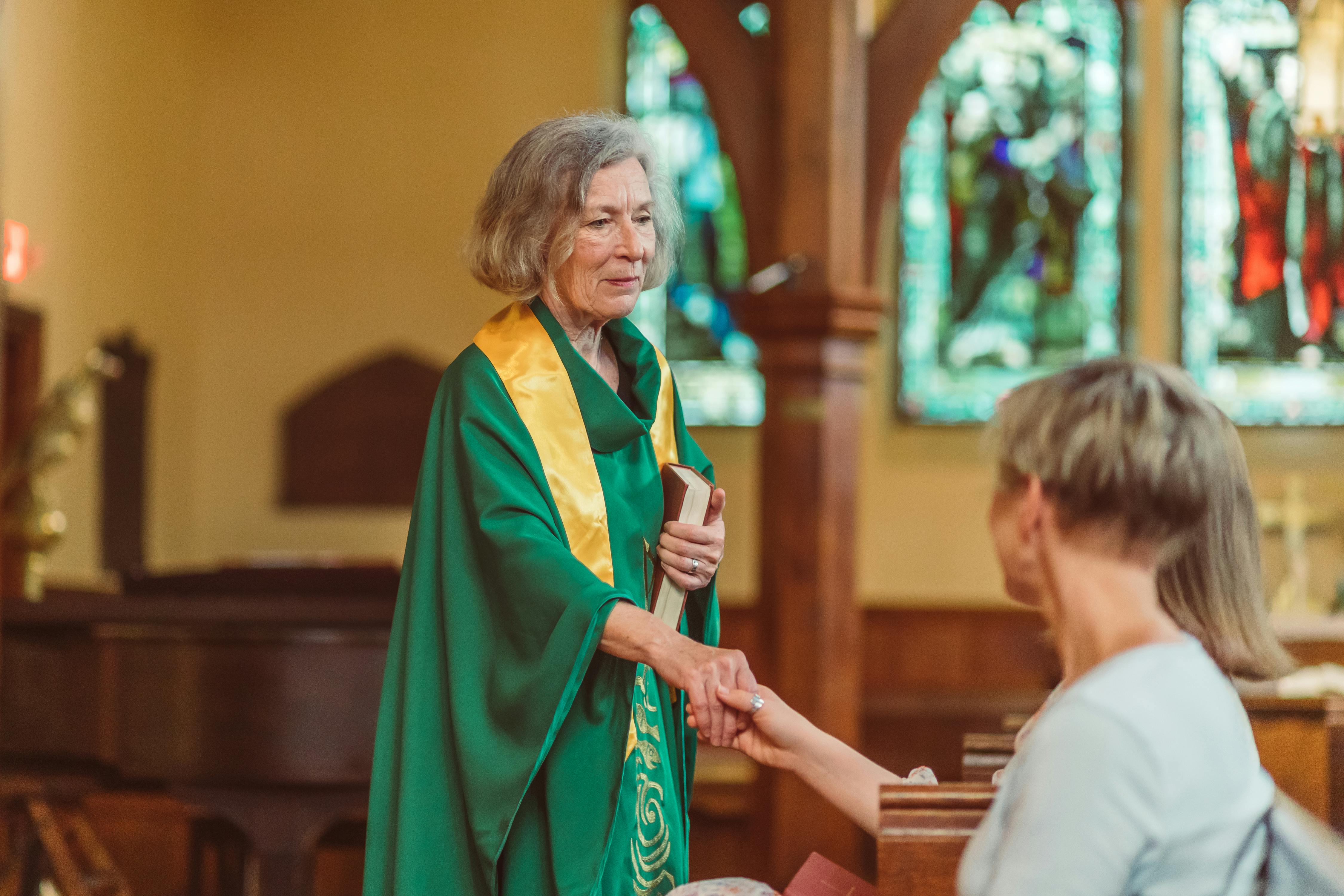 Woman Giving A Handshake With A Churchgoer · Free Stock Photo