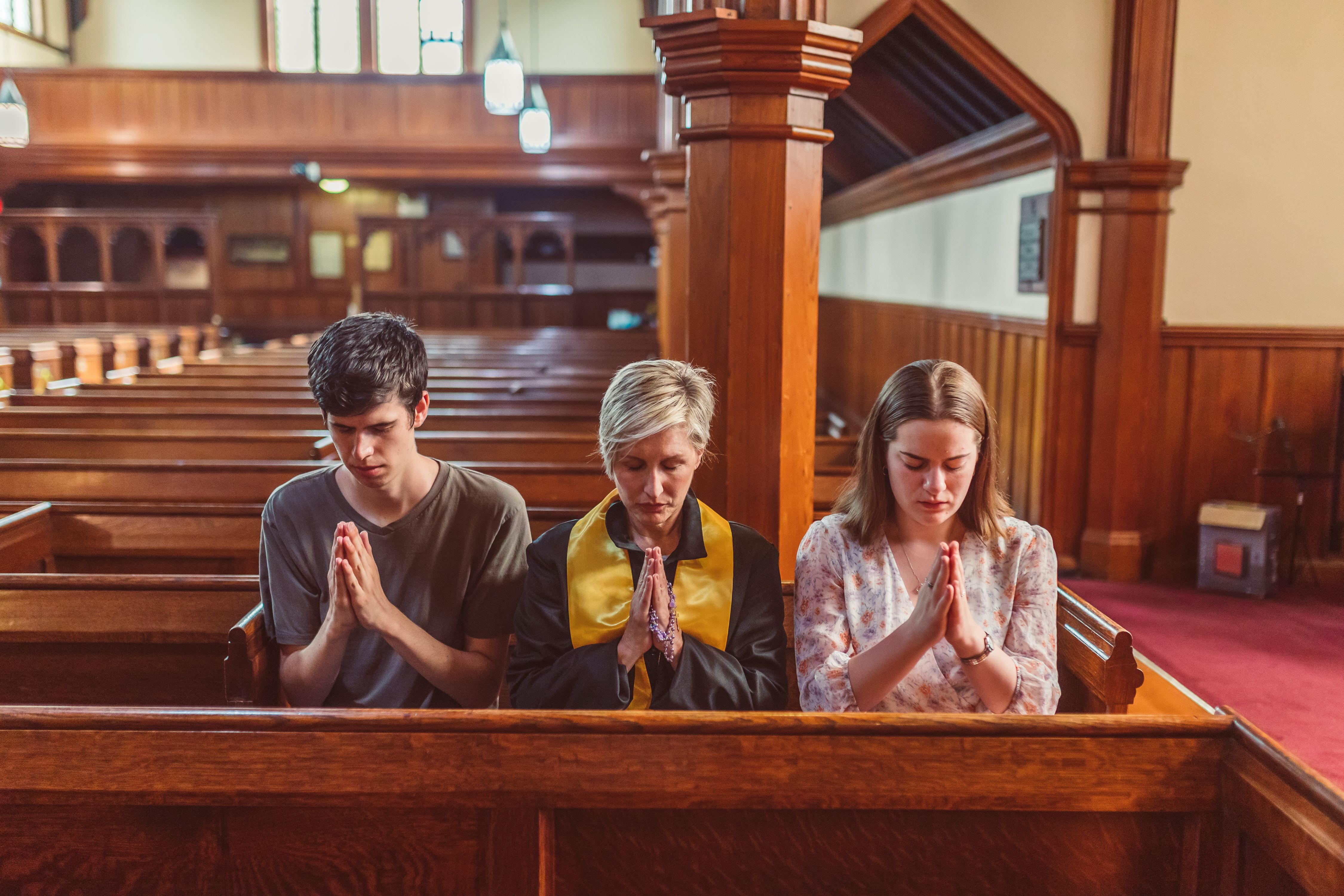 A Woman in a Blue Dress Praying Intimately · Free Stock Photo