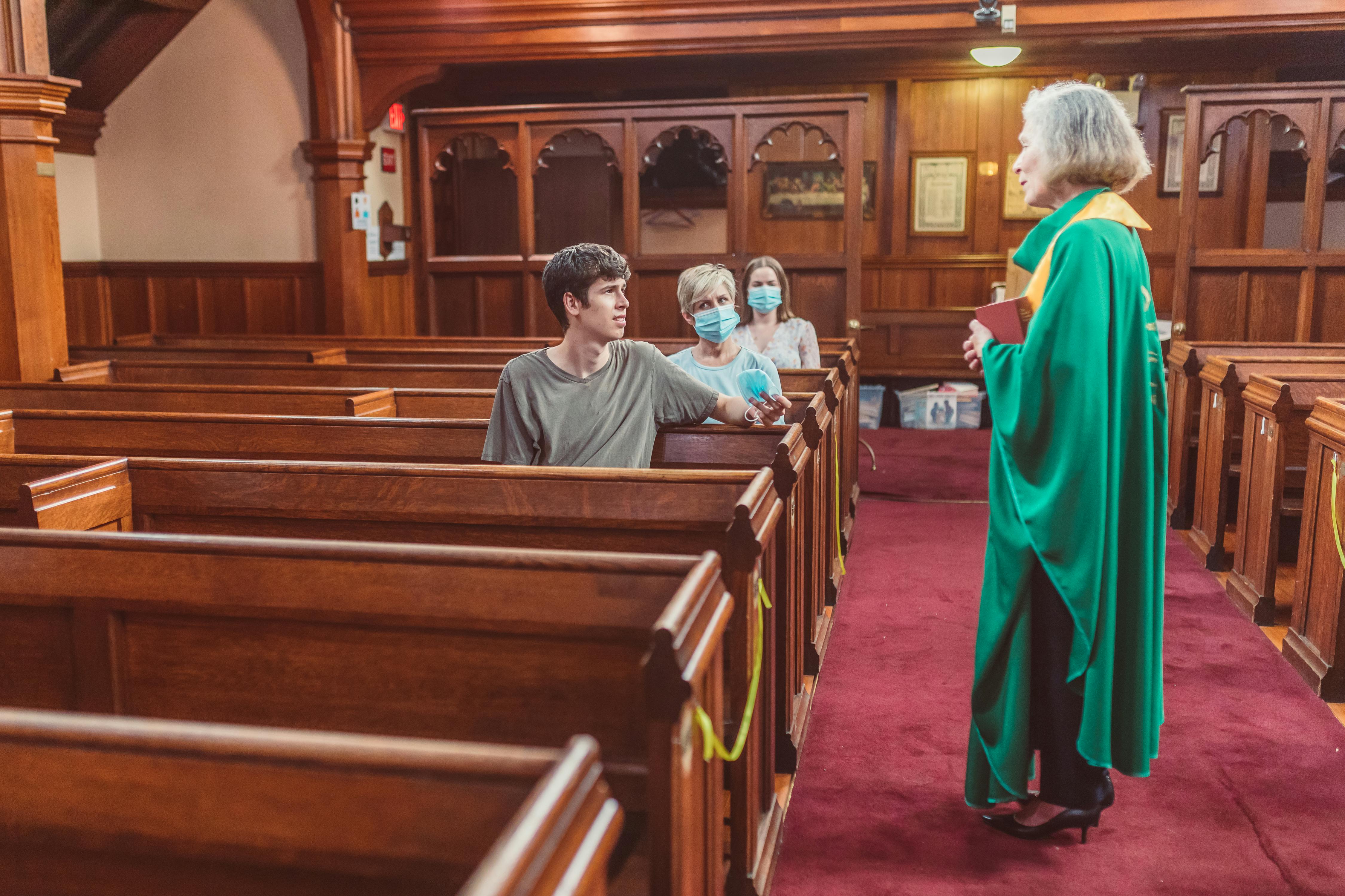 Woman Preaching To Churchgoers · Free Stock Photo