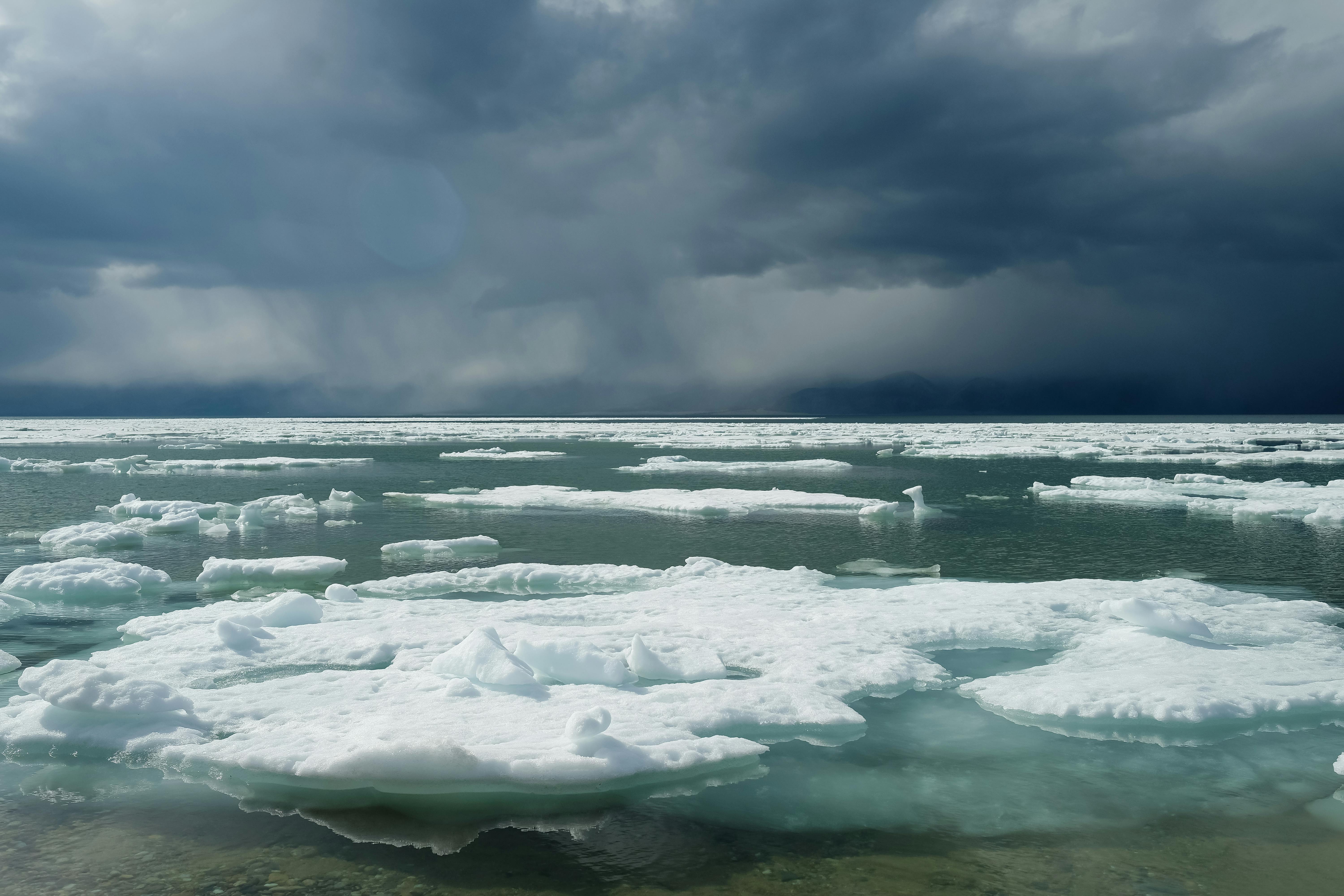Photo of Floating Sea Ice Under Cloudy Sky · Free Stock Photo