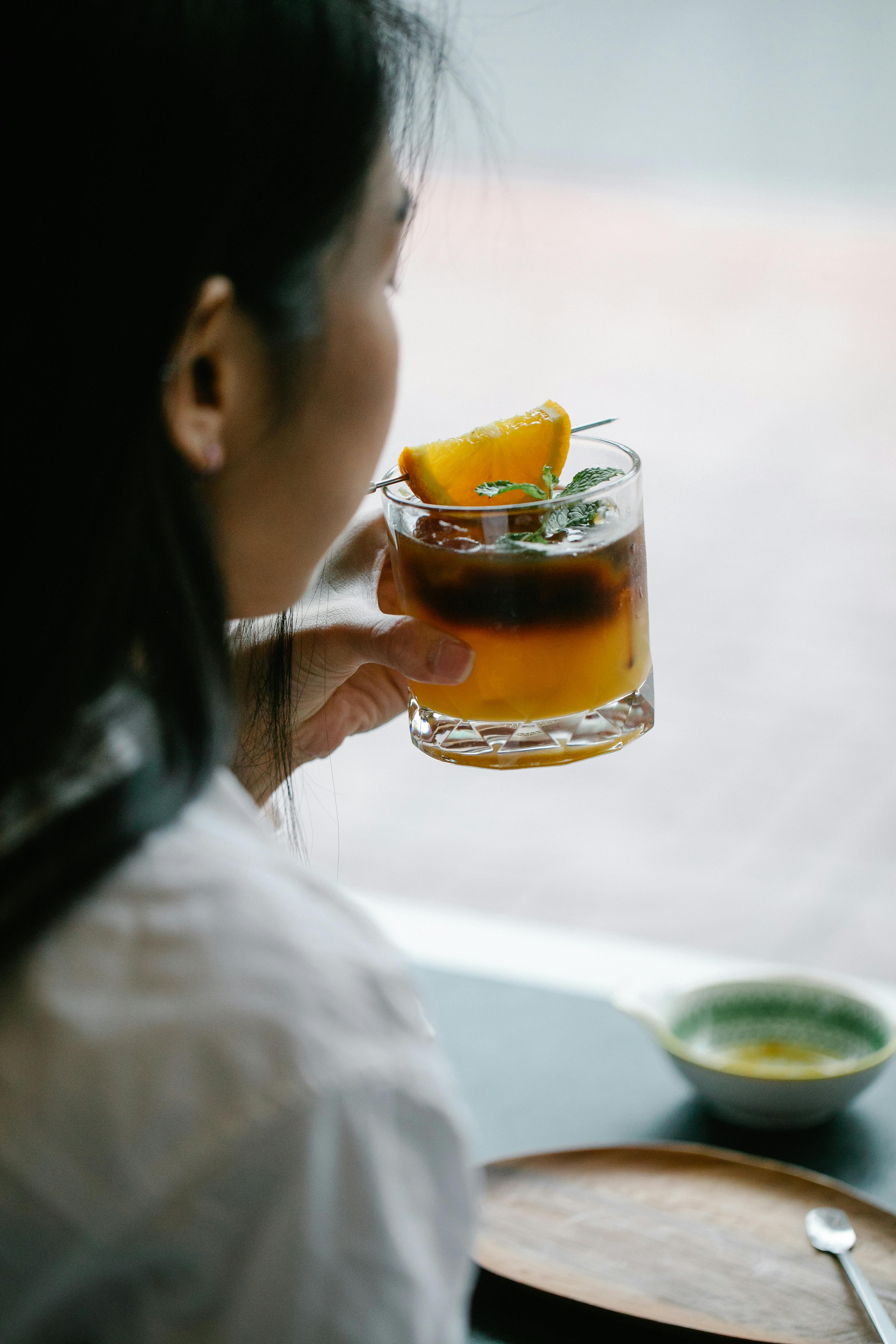 Person Holding a Drink · Free Stock Photo