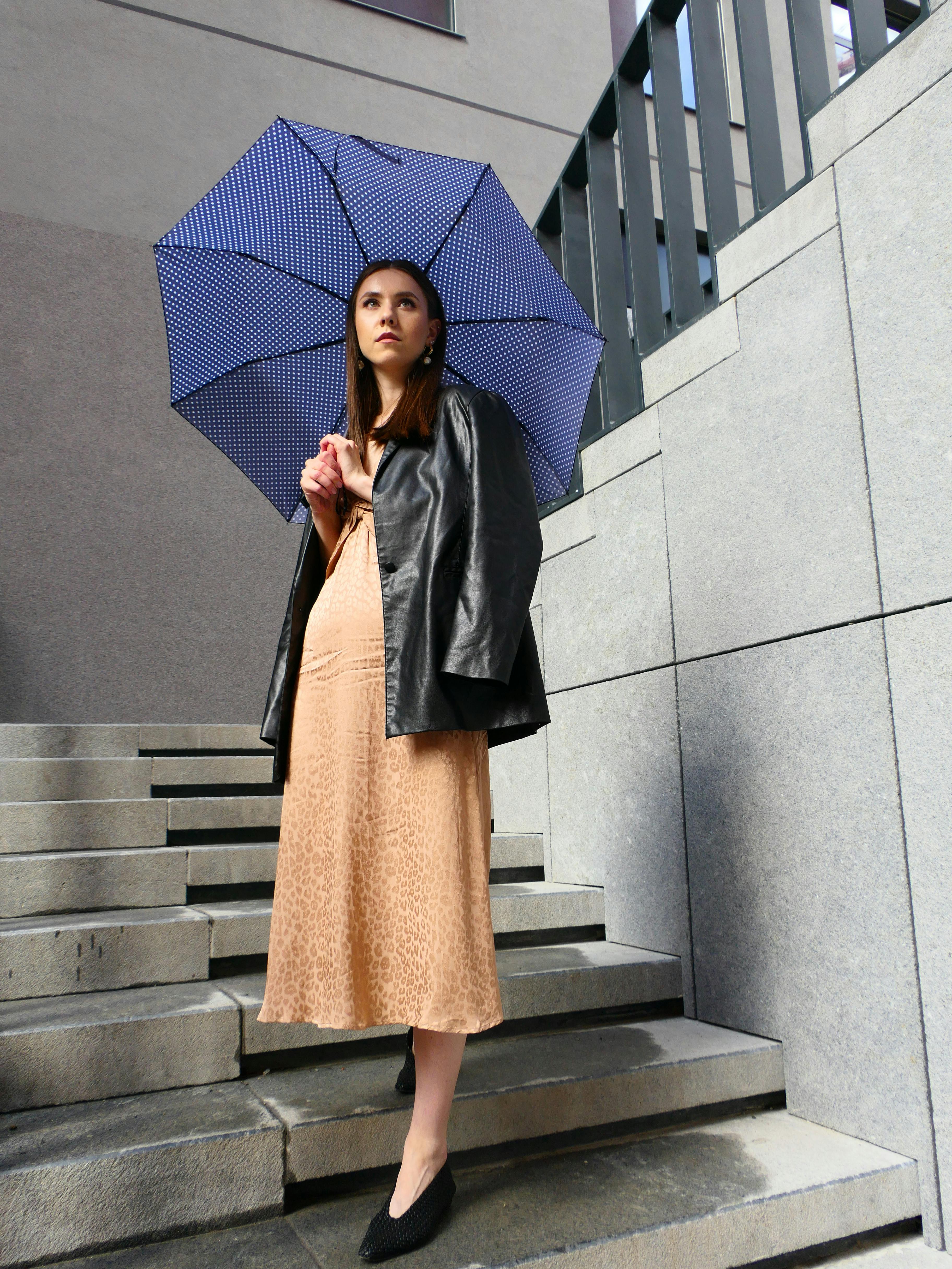 Woman Standing on Concrete Stairs with Umbrella · Free Stock Photo