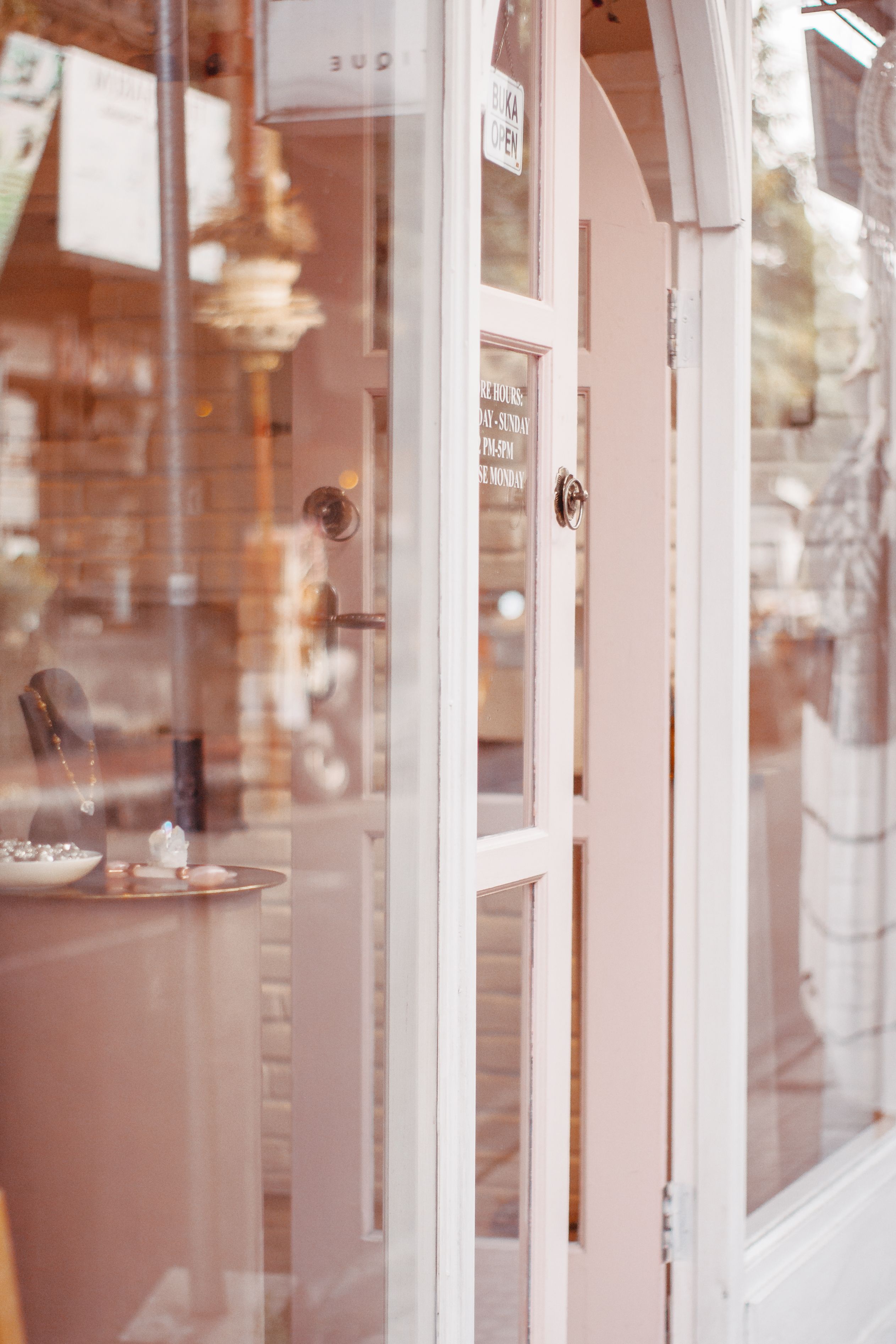Brown Wooden Framed Glass Door of a Convenience Store · Free Stock Photo