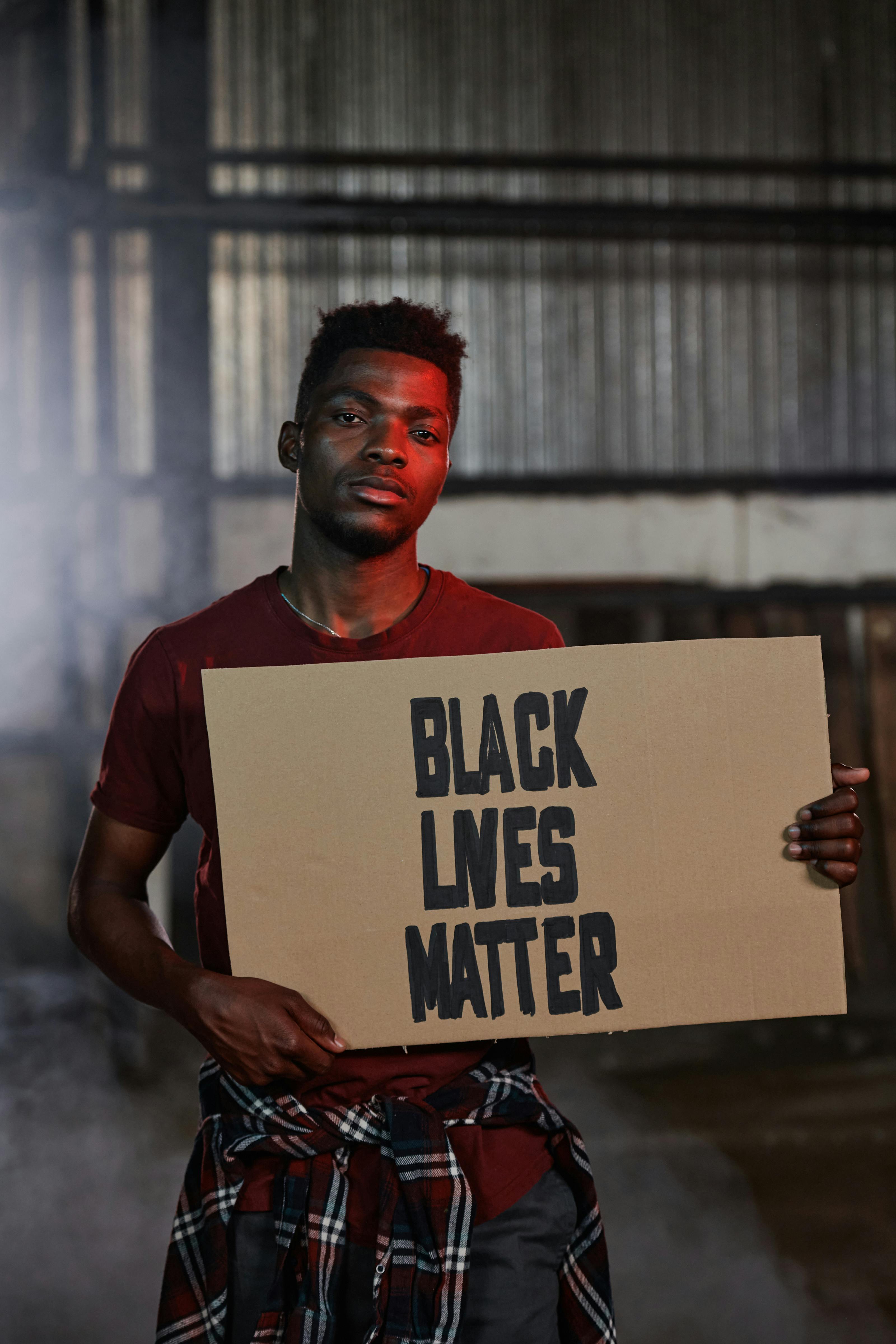 A Man Holding a Banner · Free Stock Photo
