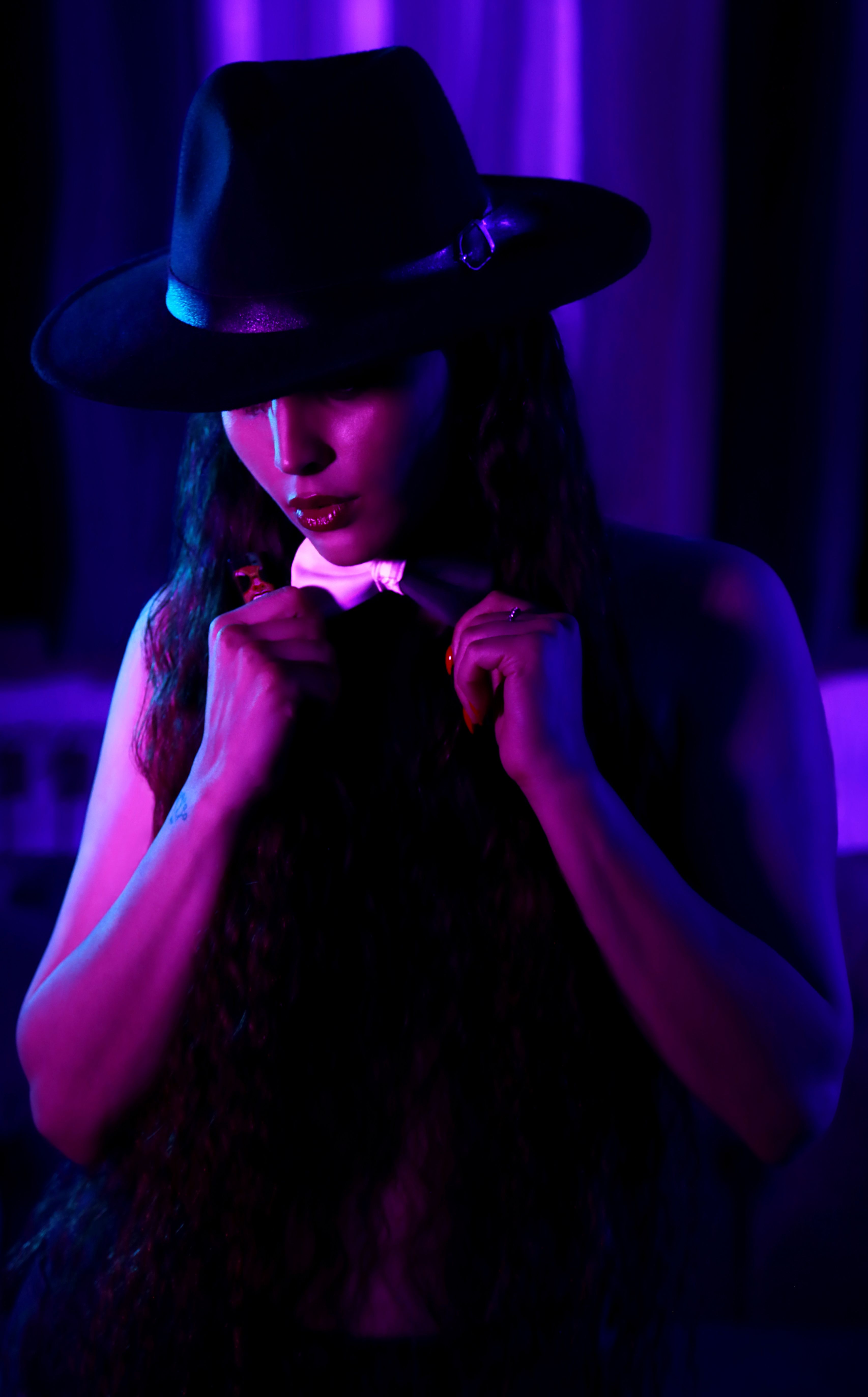 A Woman Posing Wearing a Fedora Hat · Free Stock Photo