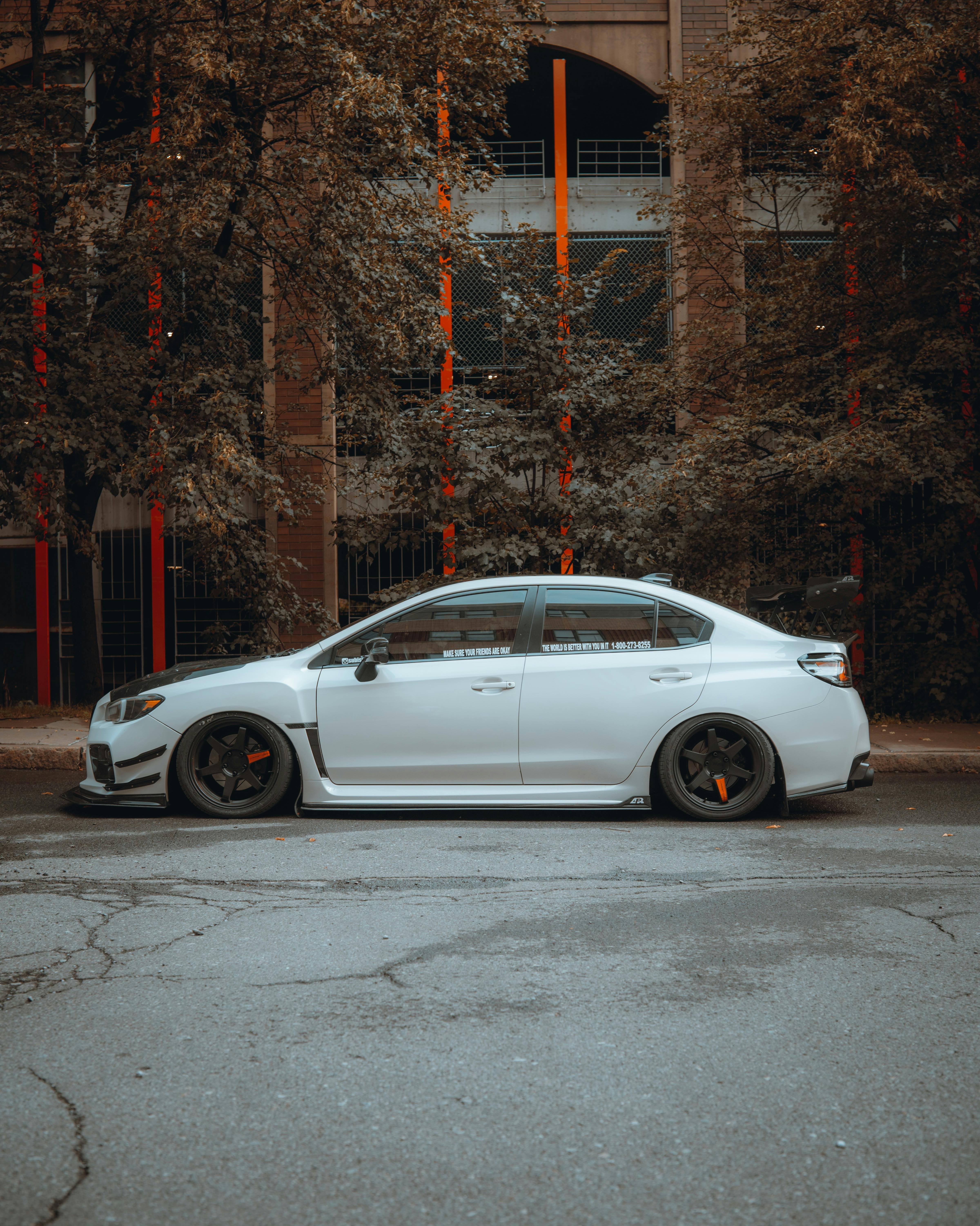 A White Car Parked on the Street · Free Stock Photo