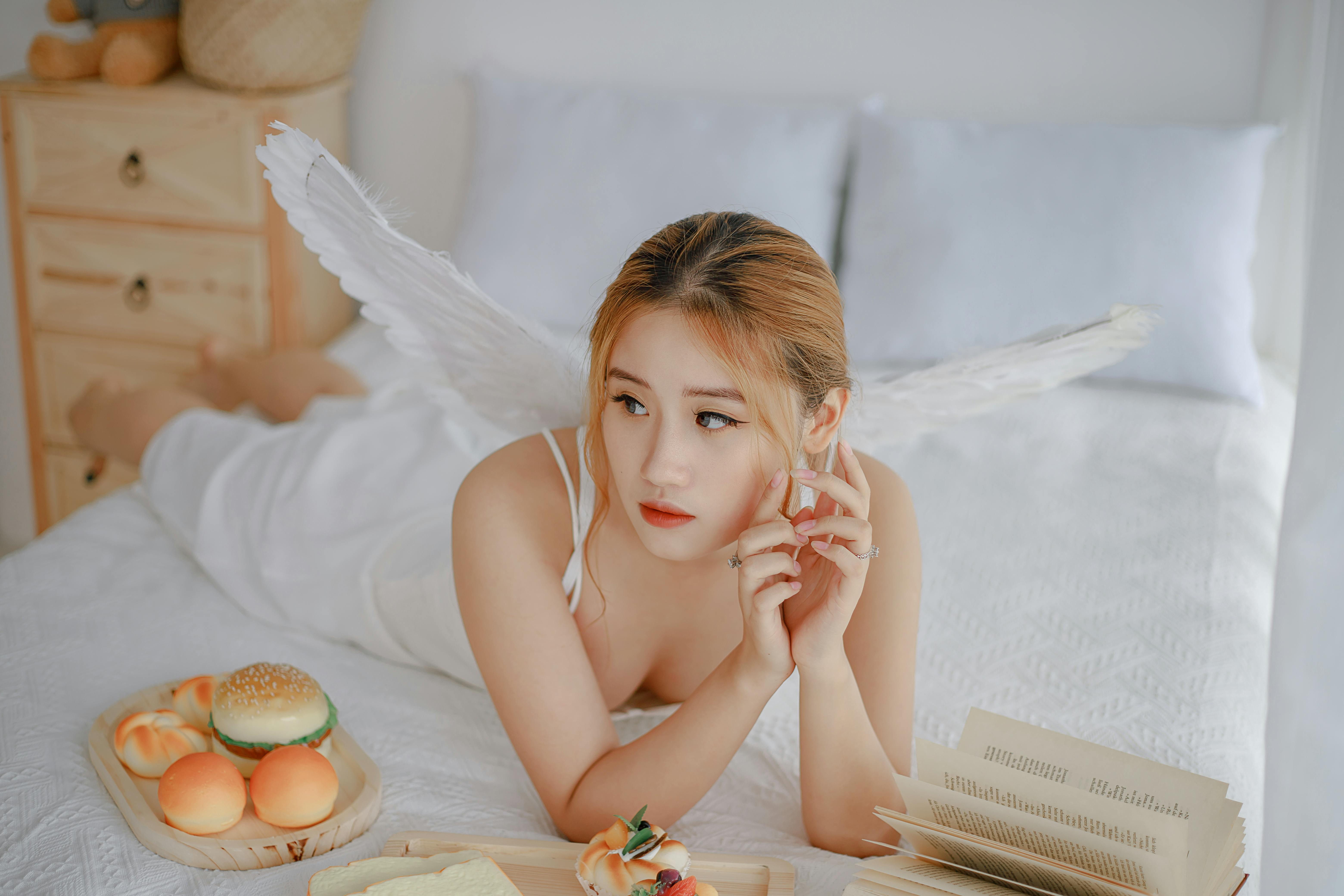 A Woman Lying on the Bed · Free Stock Photo