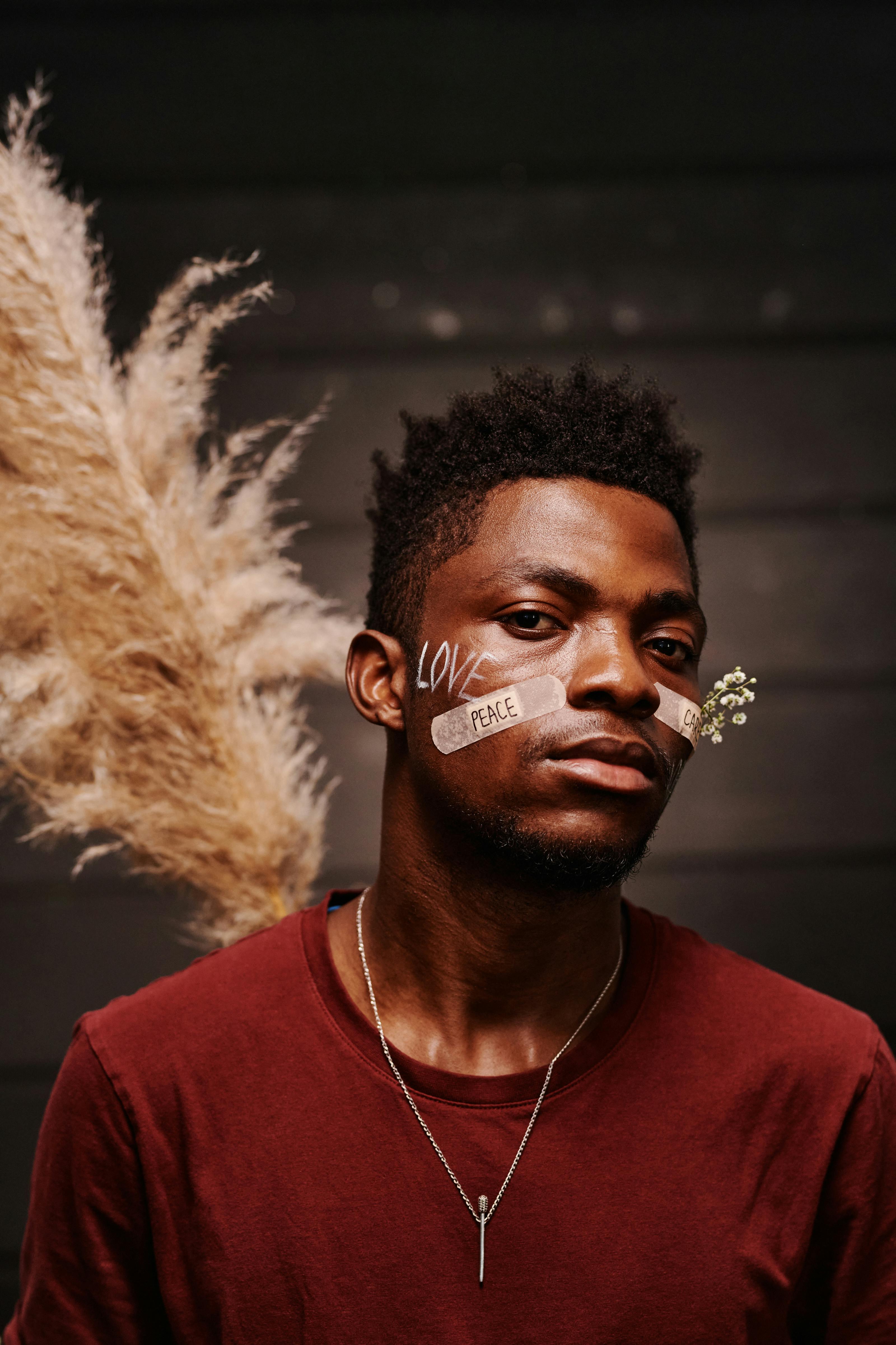 Close-Up Shot of a Man with Band Aid on His Nose · Free Stock Photo