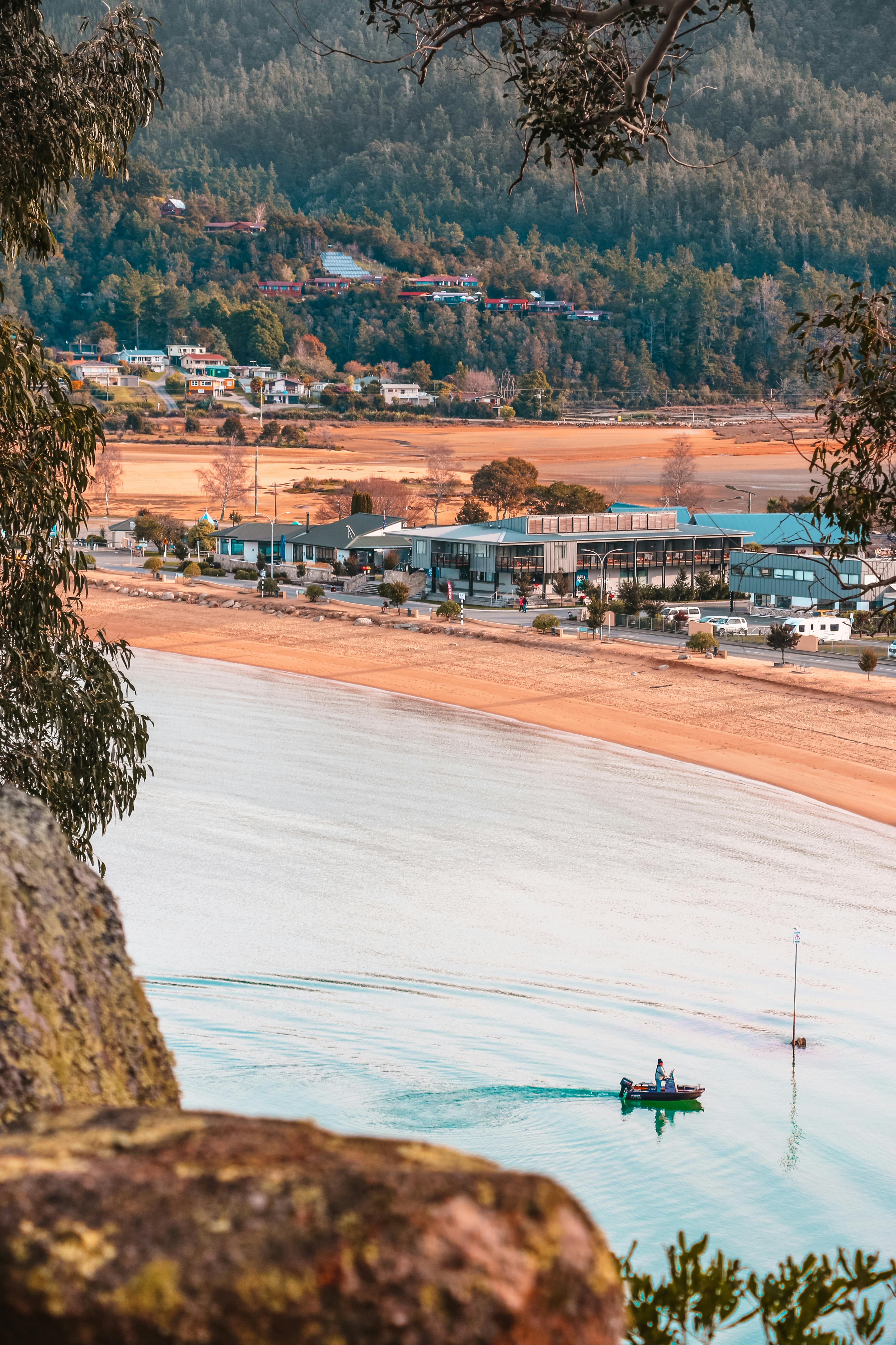 Buildings on Beach, Boat on Sea · Free Stock Photo