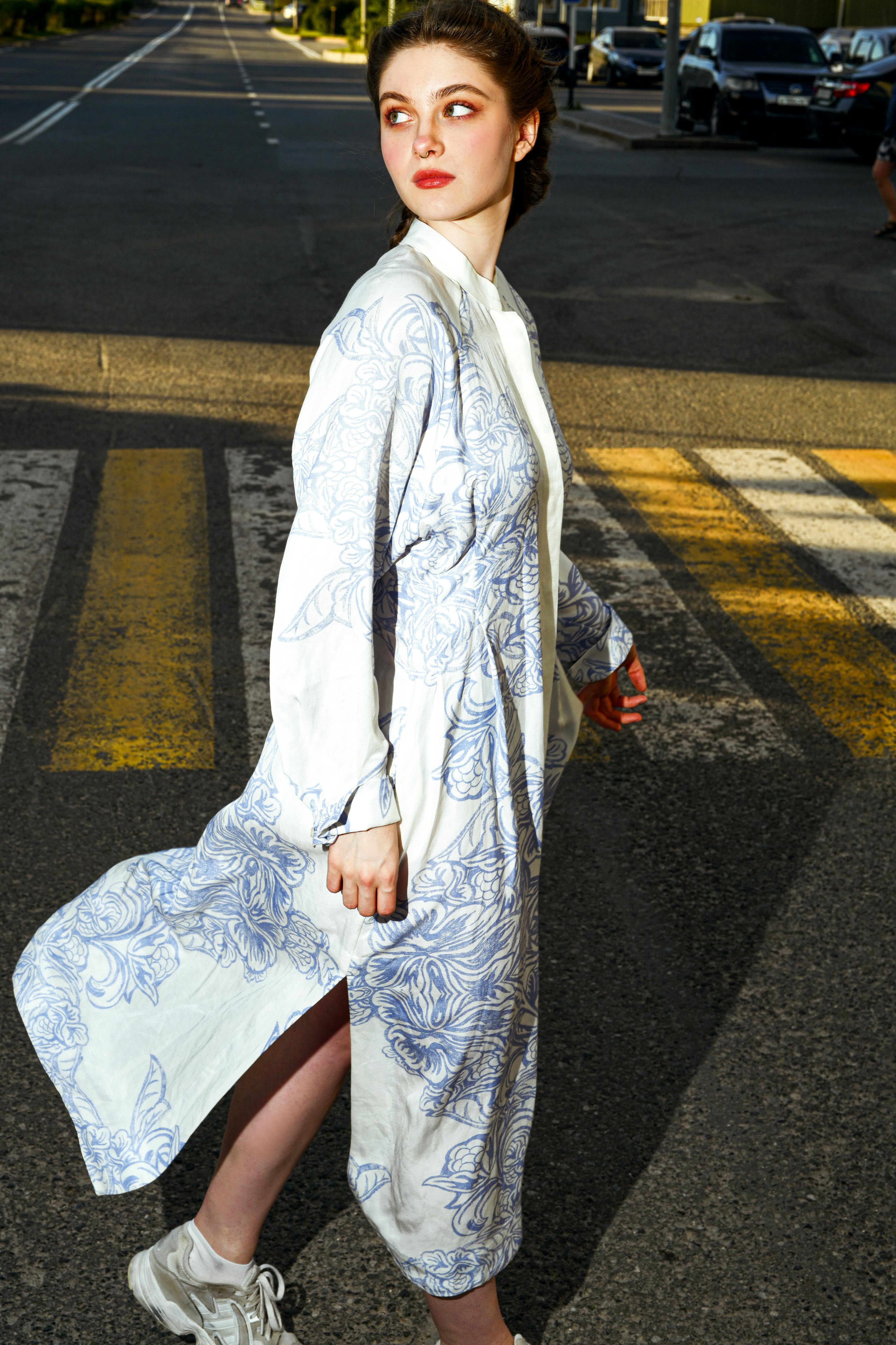 A Woman in White Robe Walking on the Road · Free Stock Photo